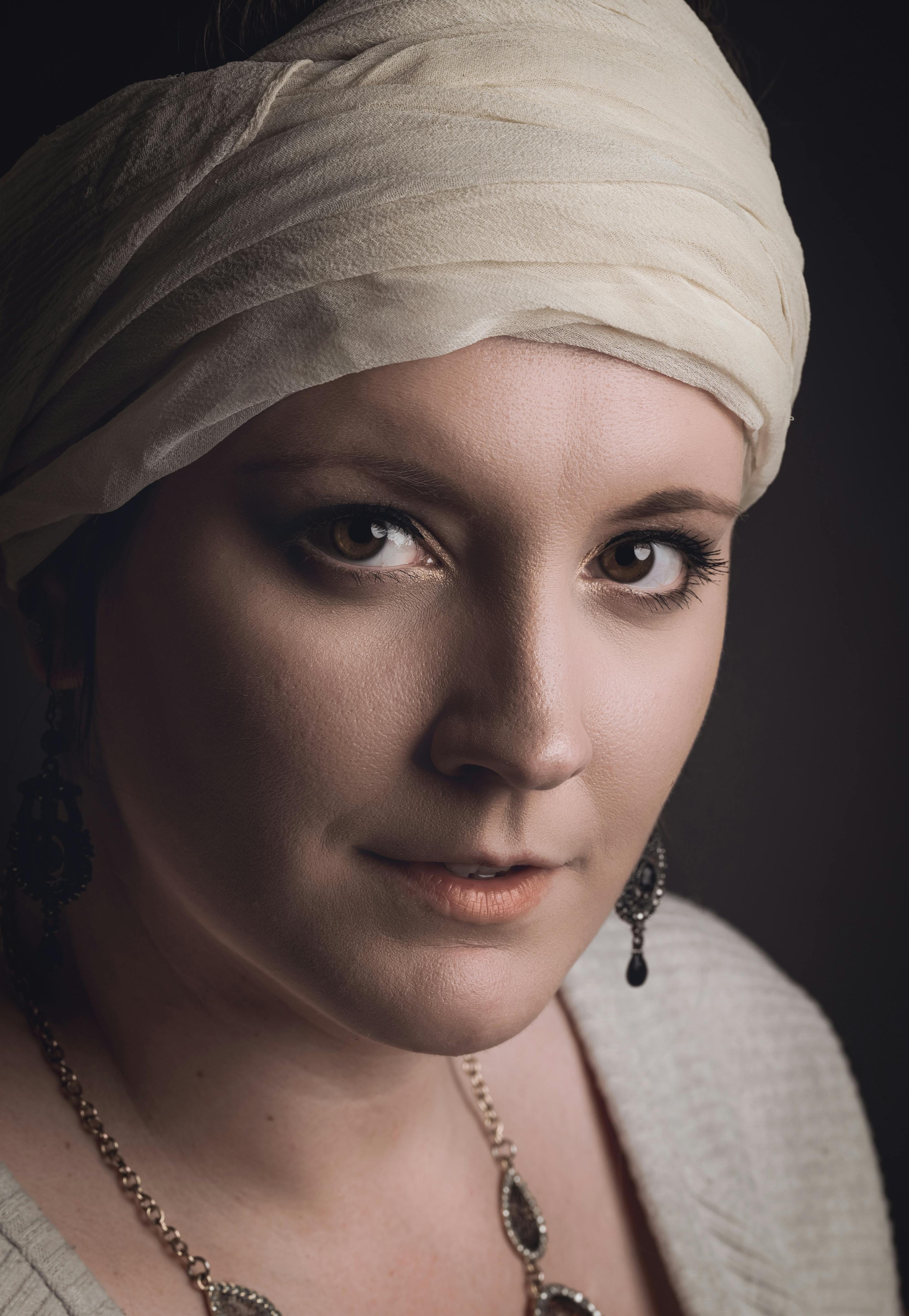 Portrait of a Woman in a White Headscarf and Long Earrings · Free Stock ...
