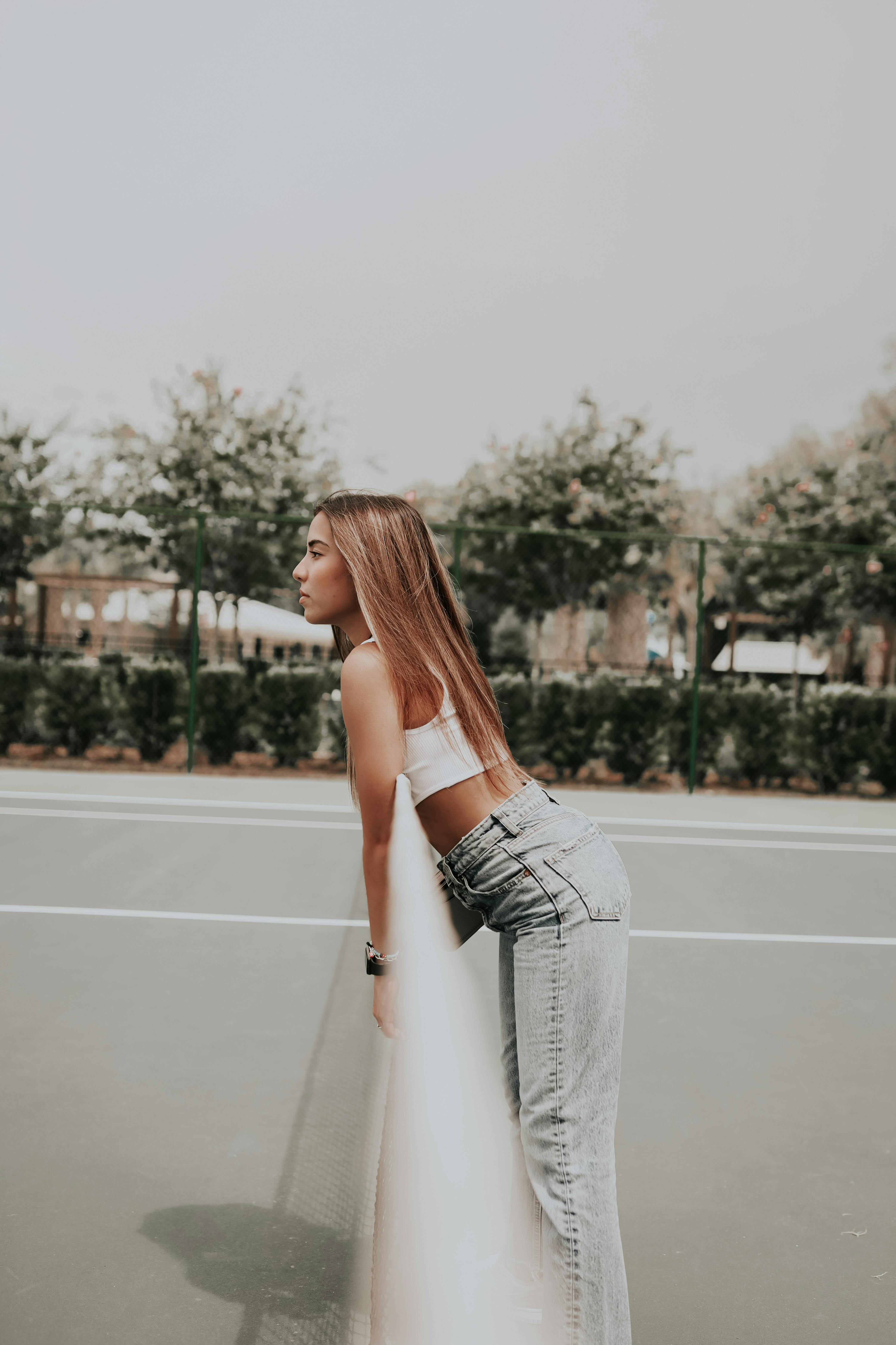 Beautiful Woman Leaning on Railing · Free Stock Photo