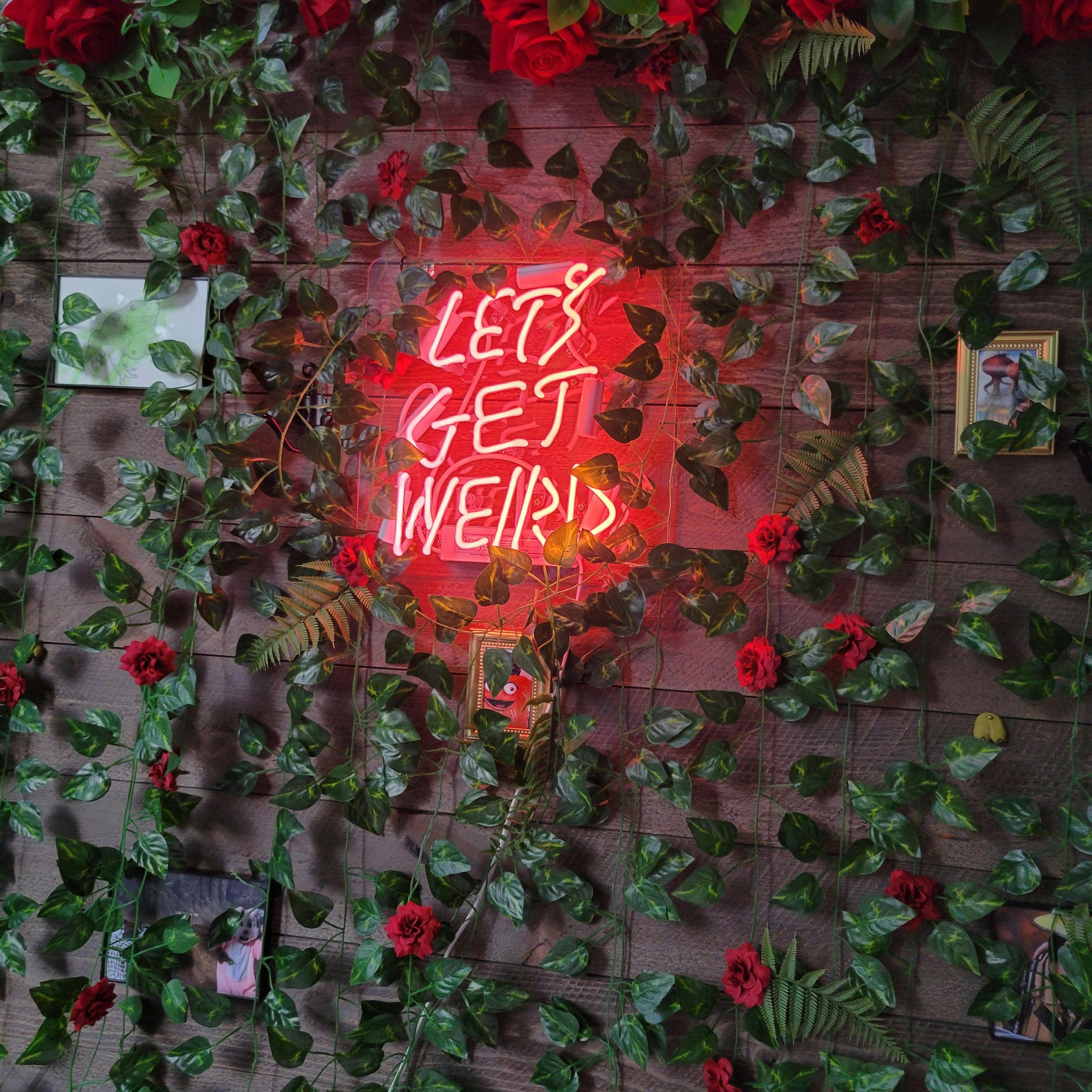 Red Neon Light in Shape of Slogan on Wall · Free Stock Photo