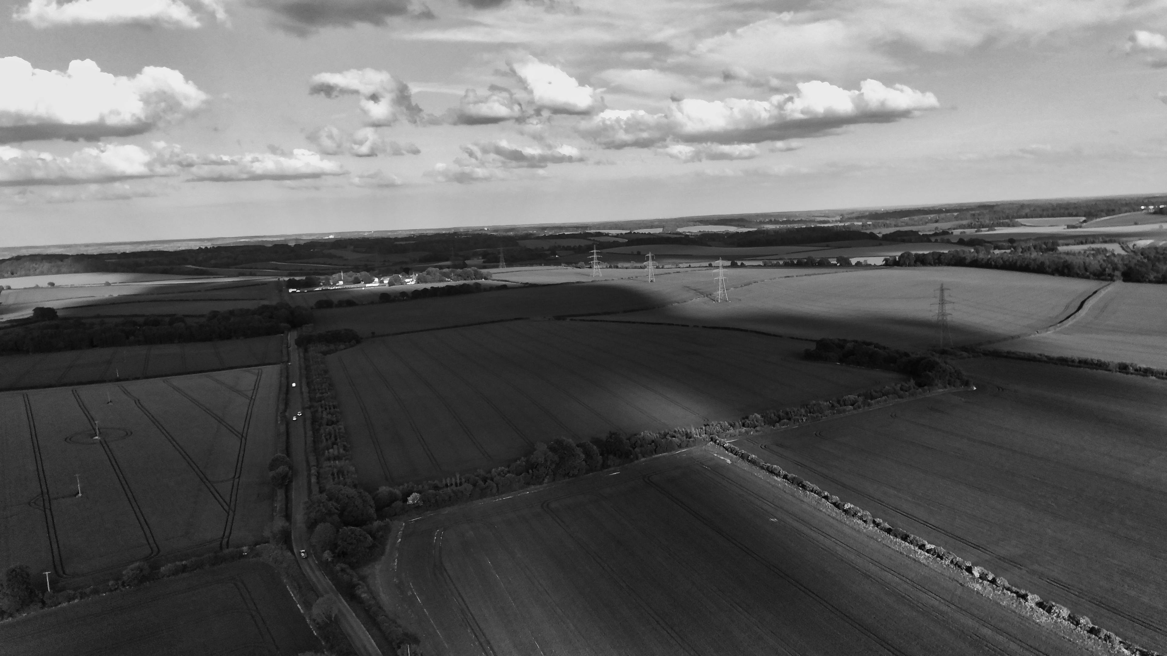 Clouds over Fields in Black and White · Free Stock Photo