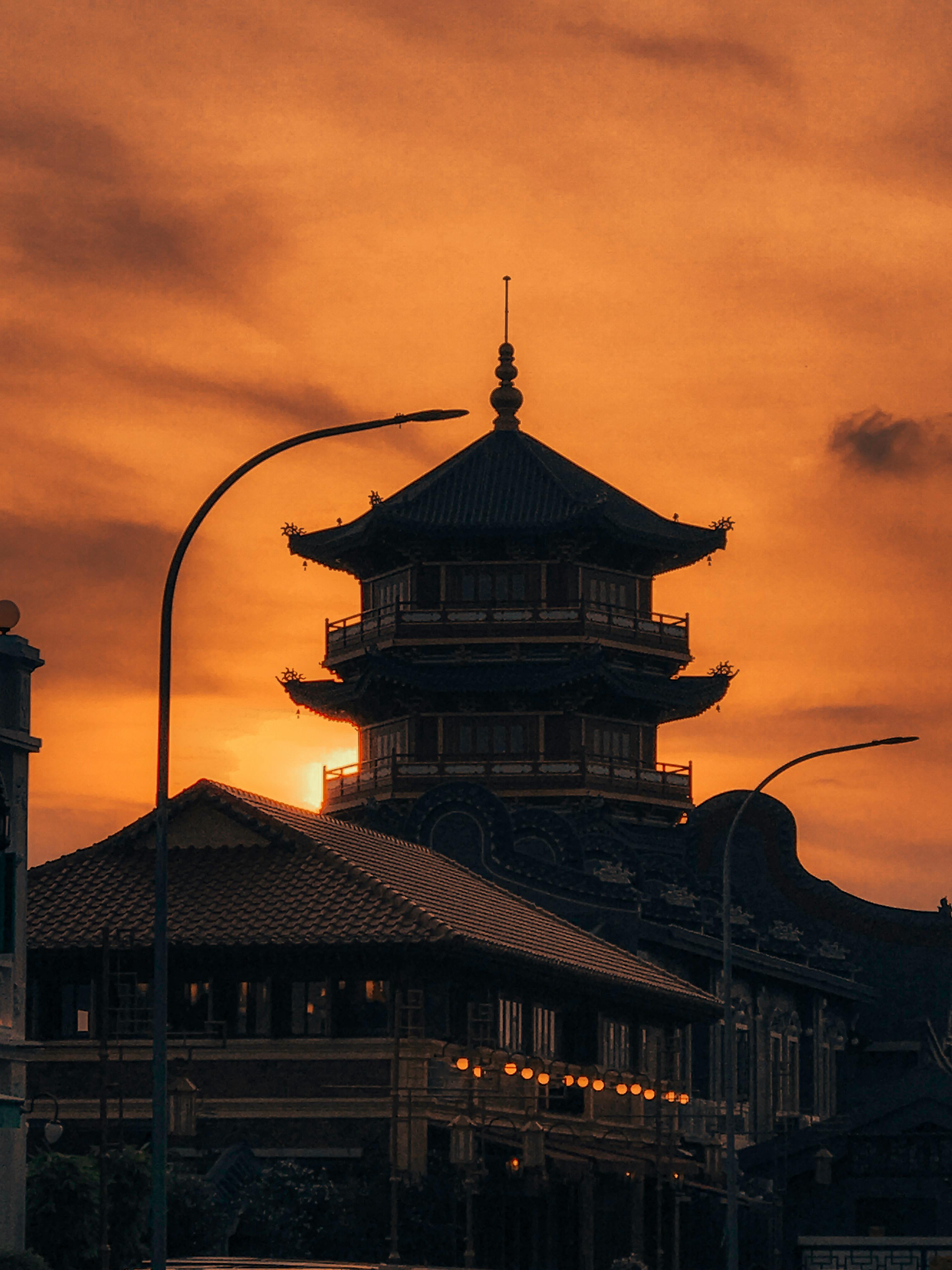 Photo of a Building with a Tower at Sunset · Free Stock Photo