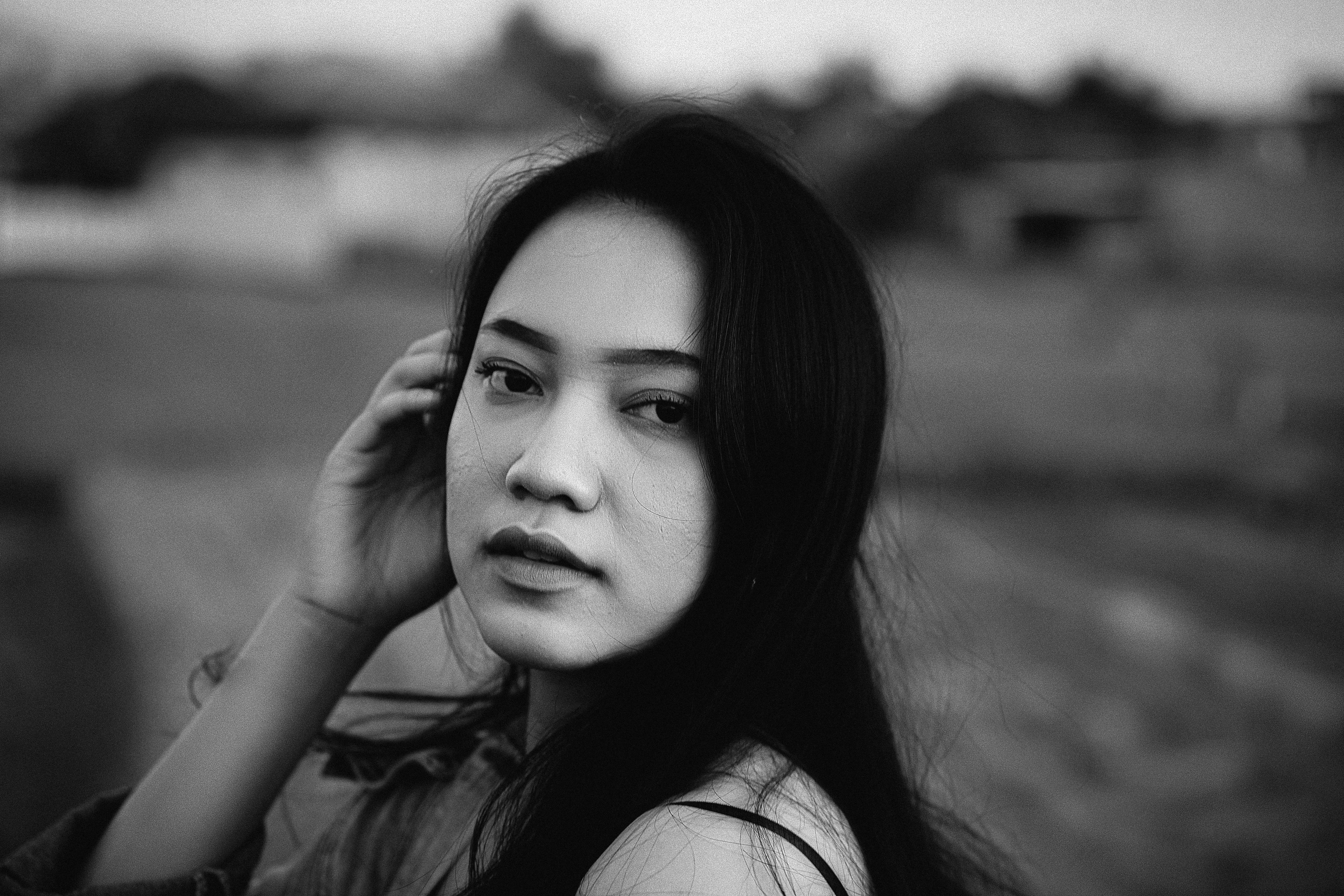 Grayscale Photo of a Woman Looking at the Camera · Free Stock Photo
