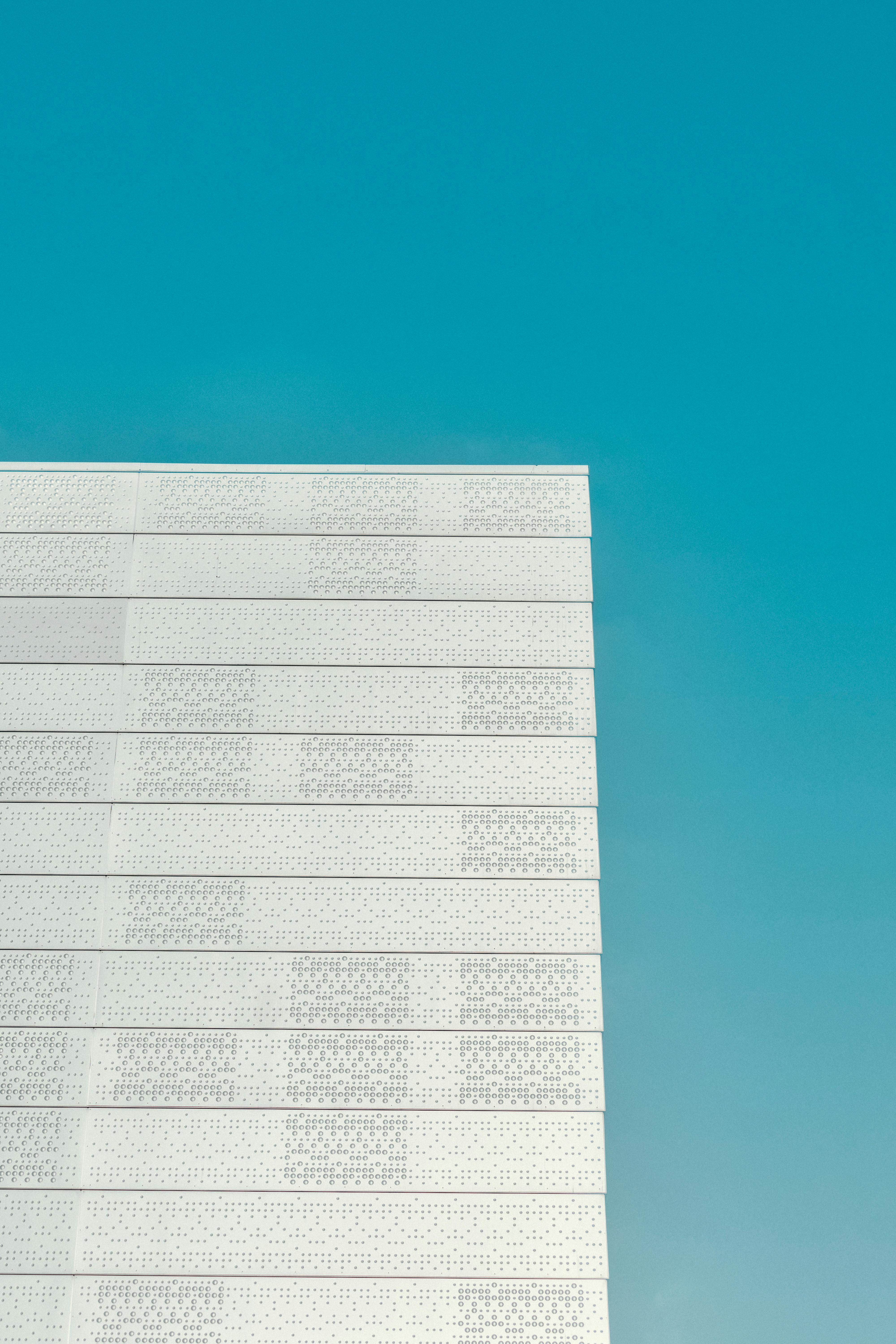 Red Concrete Building Under the Blue Sky · Free Stock Photo