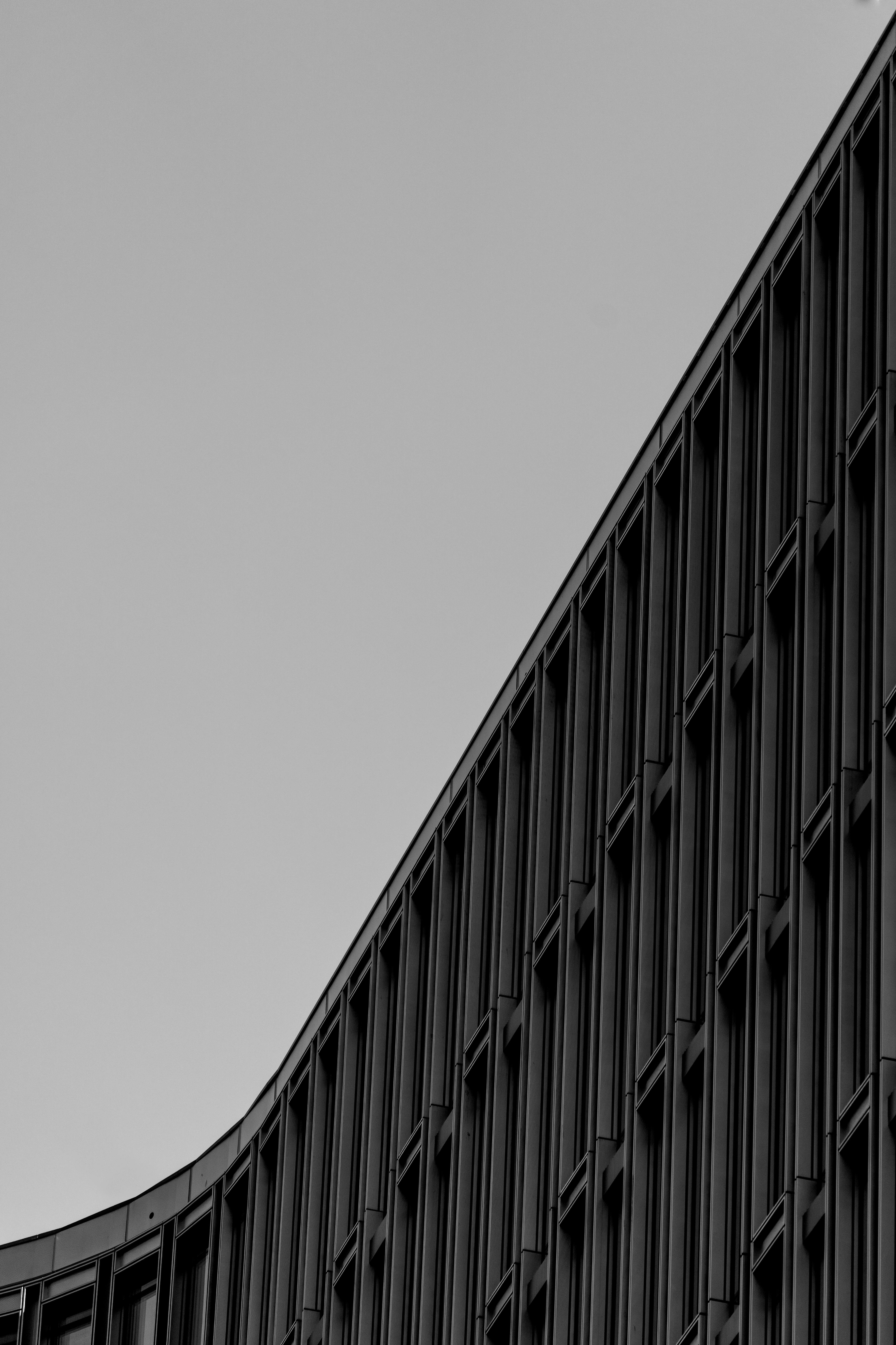 Grayscale Photo of a Concrete Building · Free Stock Photo
