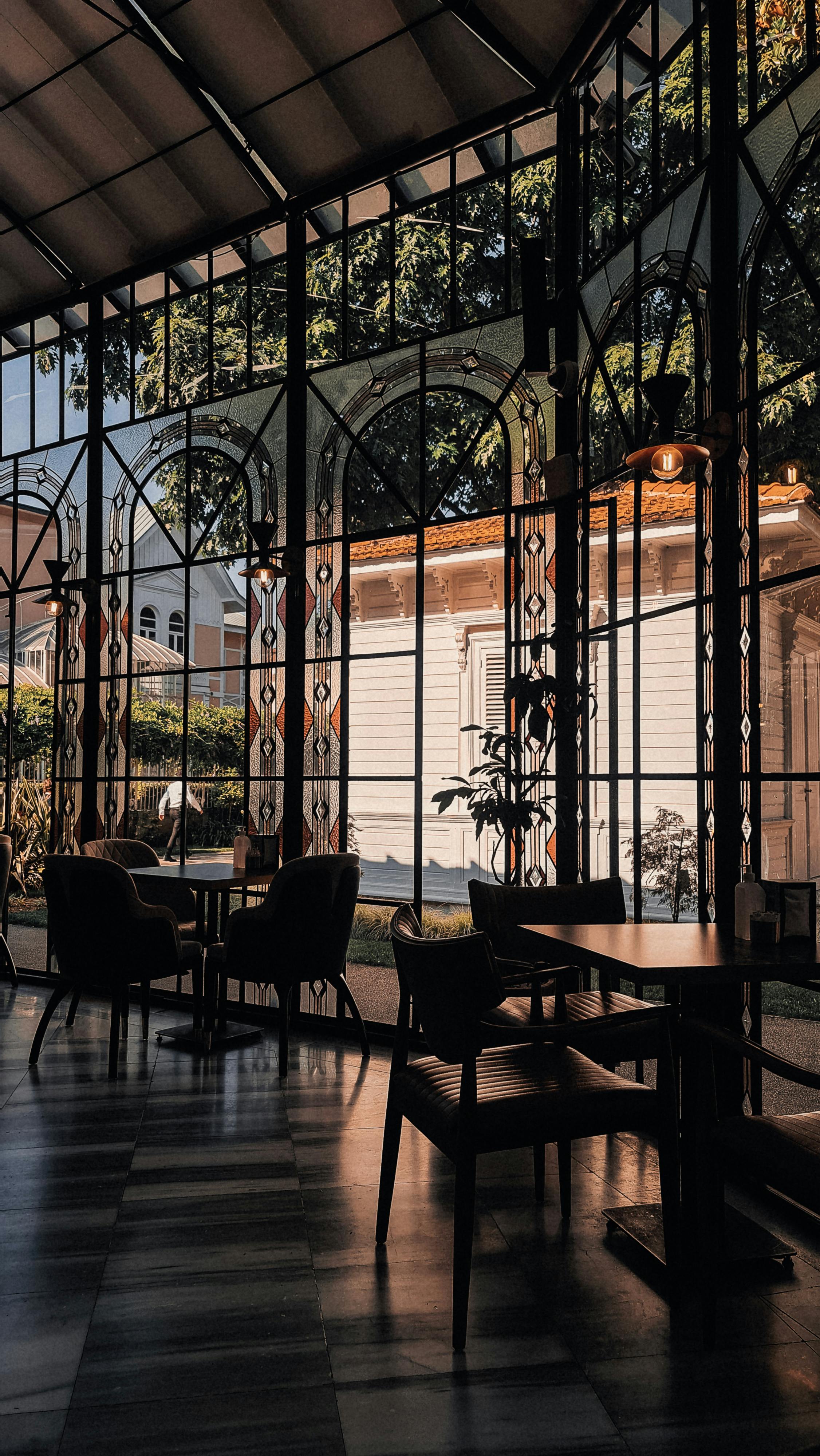 Wooden Table with Chairs inside the Restaurant · Free Stock Photo