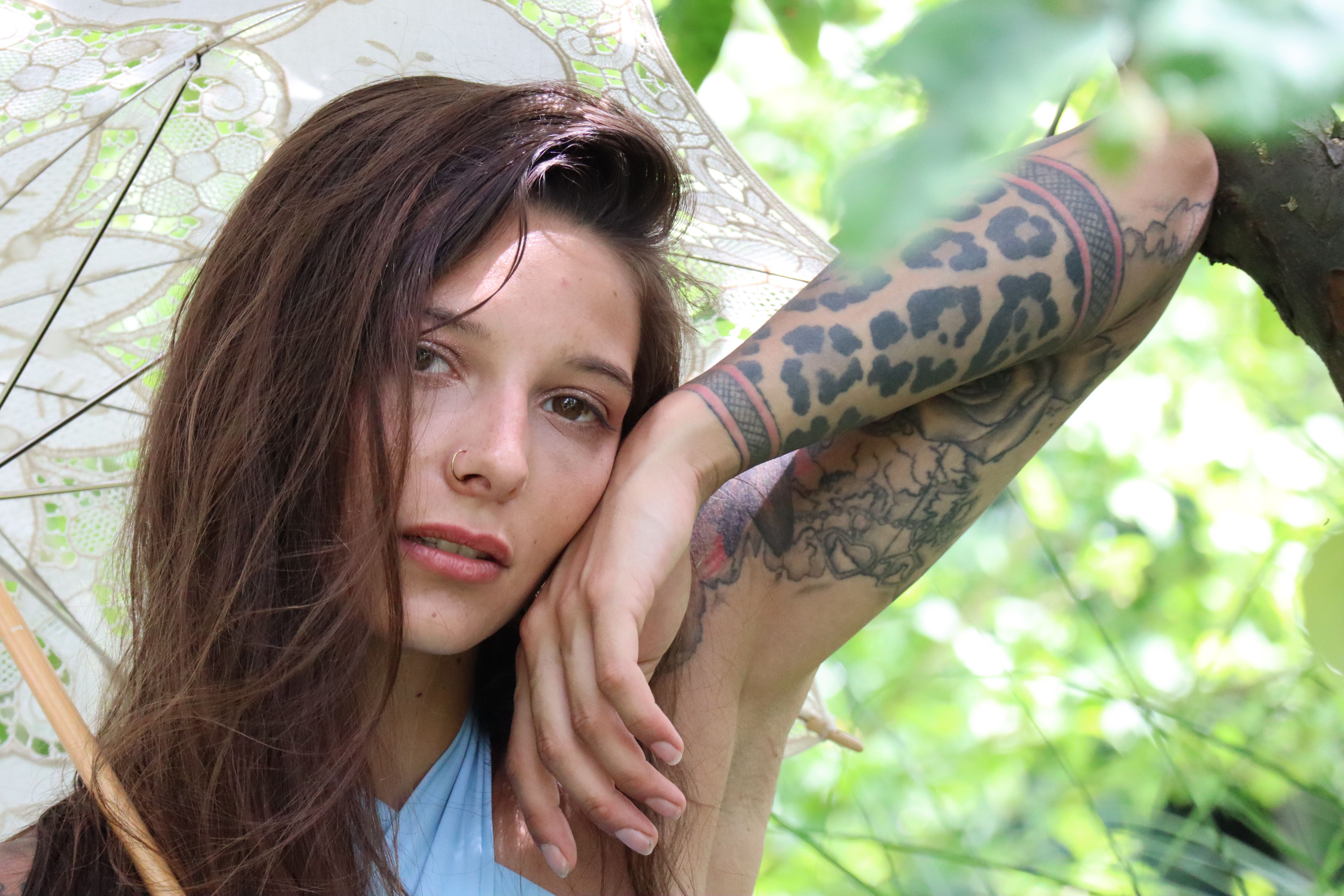 Beautiful Woman with Arm Tattoo · Free Stock Photo
