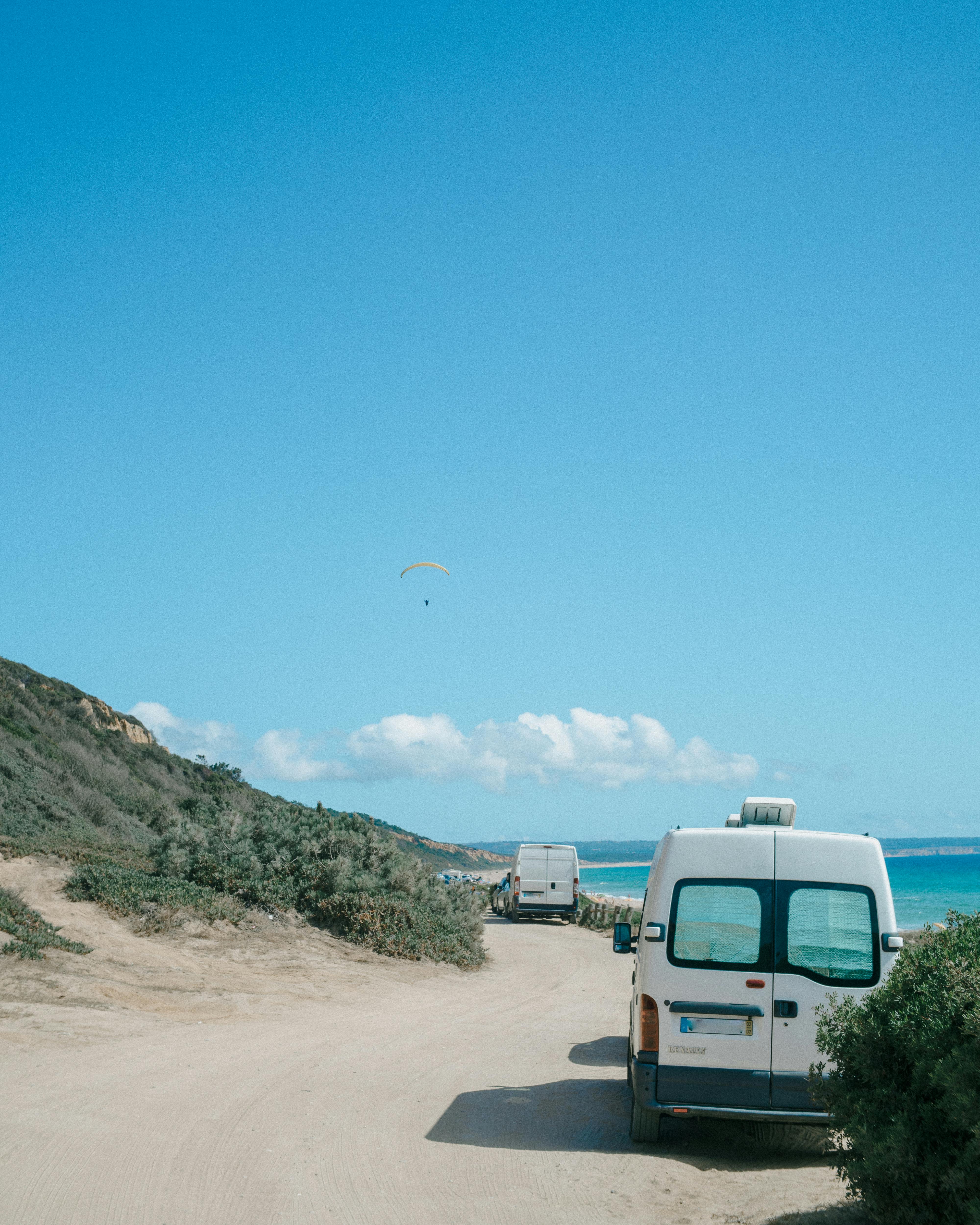 White Van on Dirt Road · Free Stock Photo