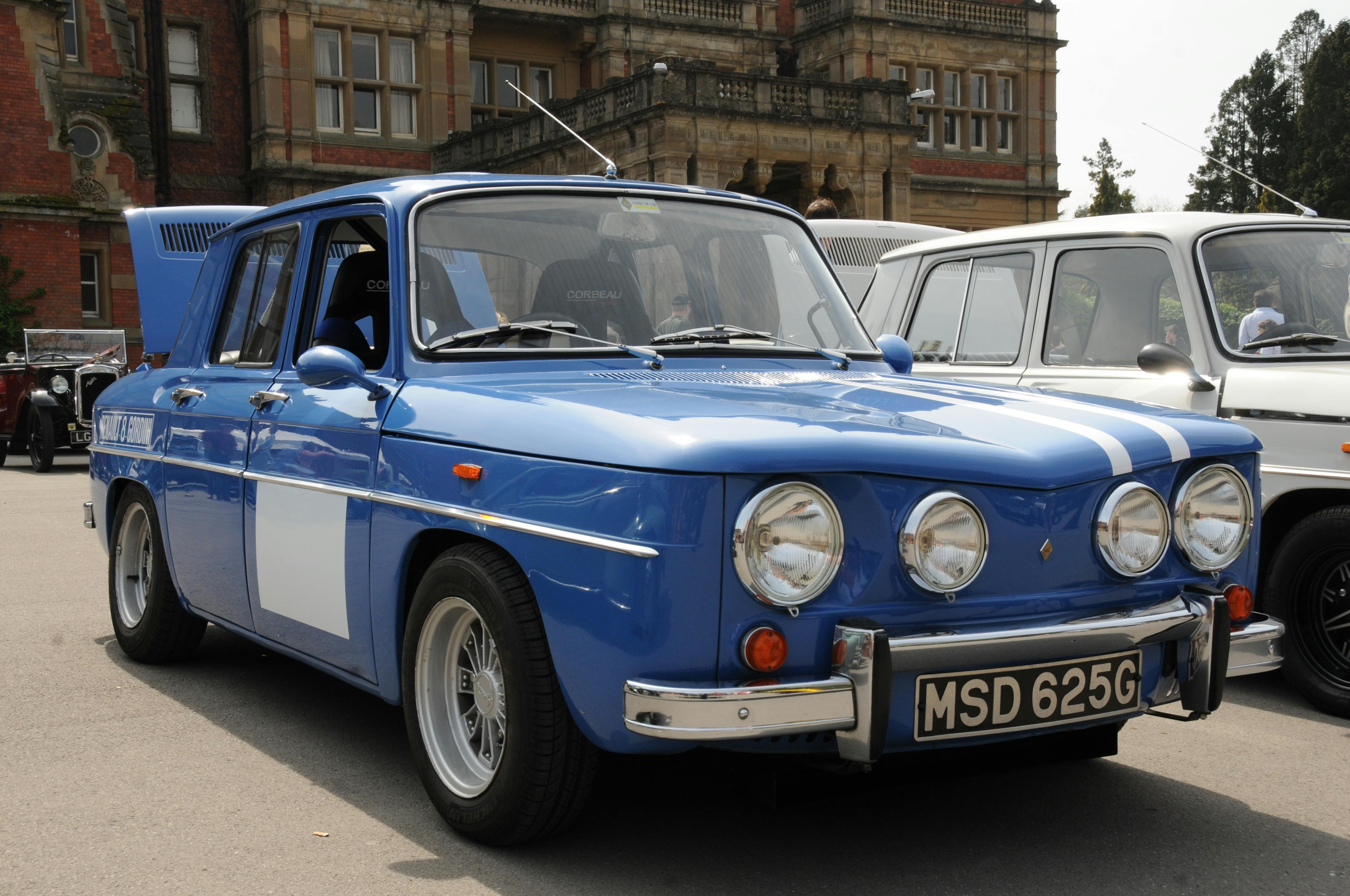 Blue Classic Car Parked on an Open Lot · Free Stock Photo