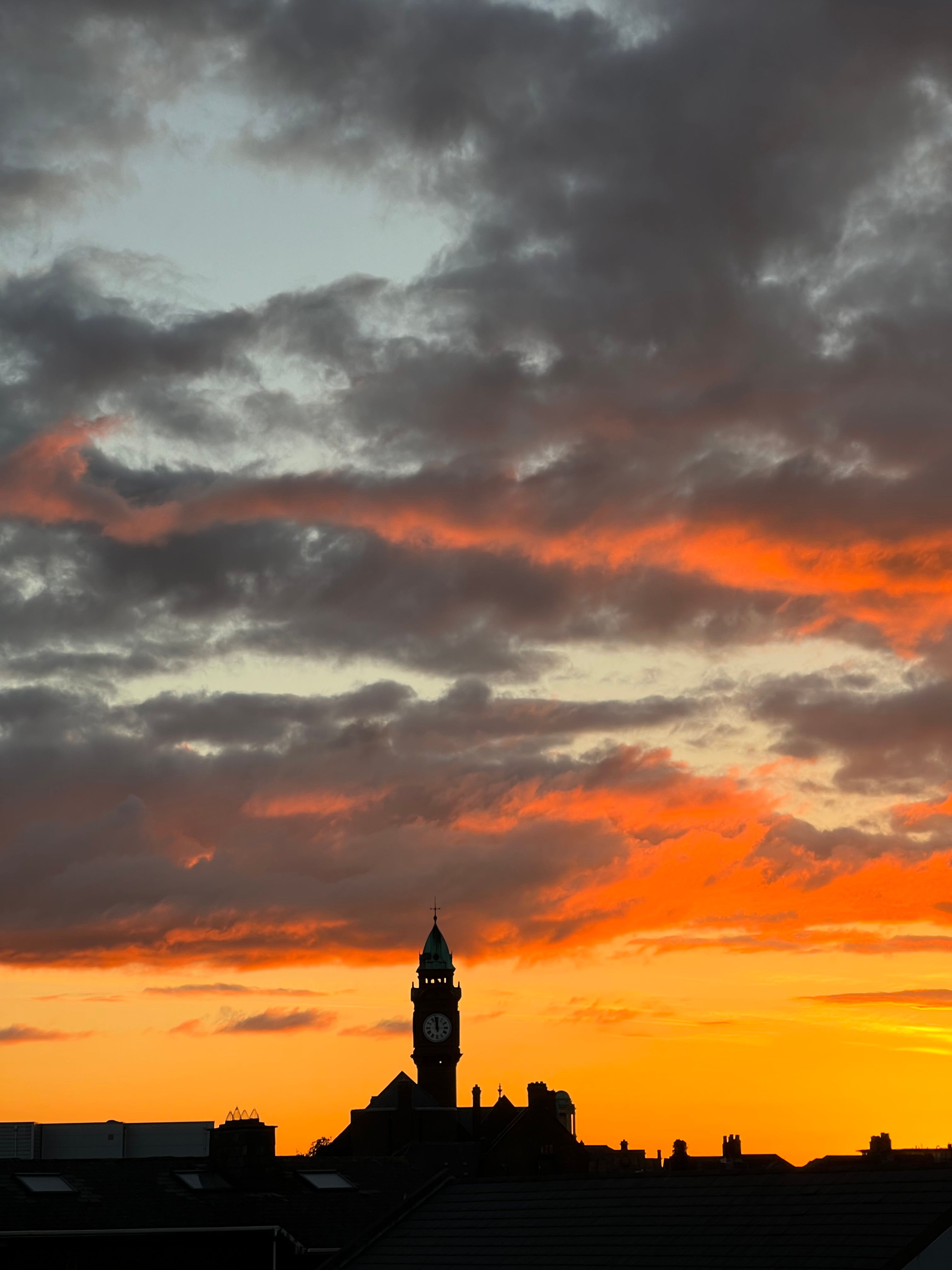 Clouds over Tower in Town at Sunset · Free Stock Photo