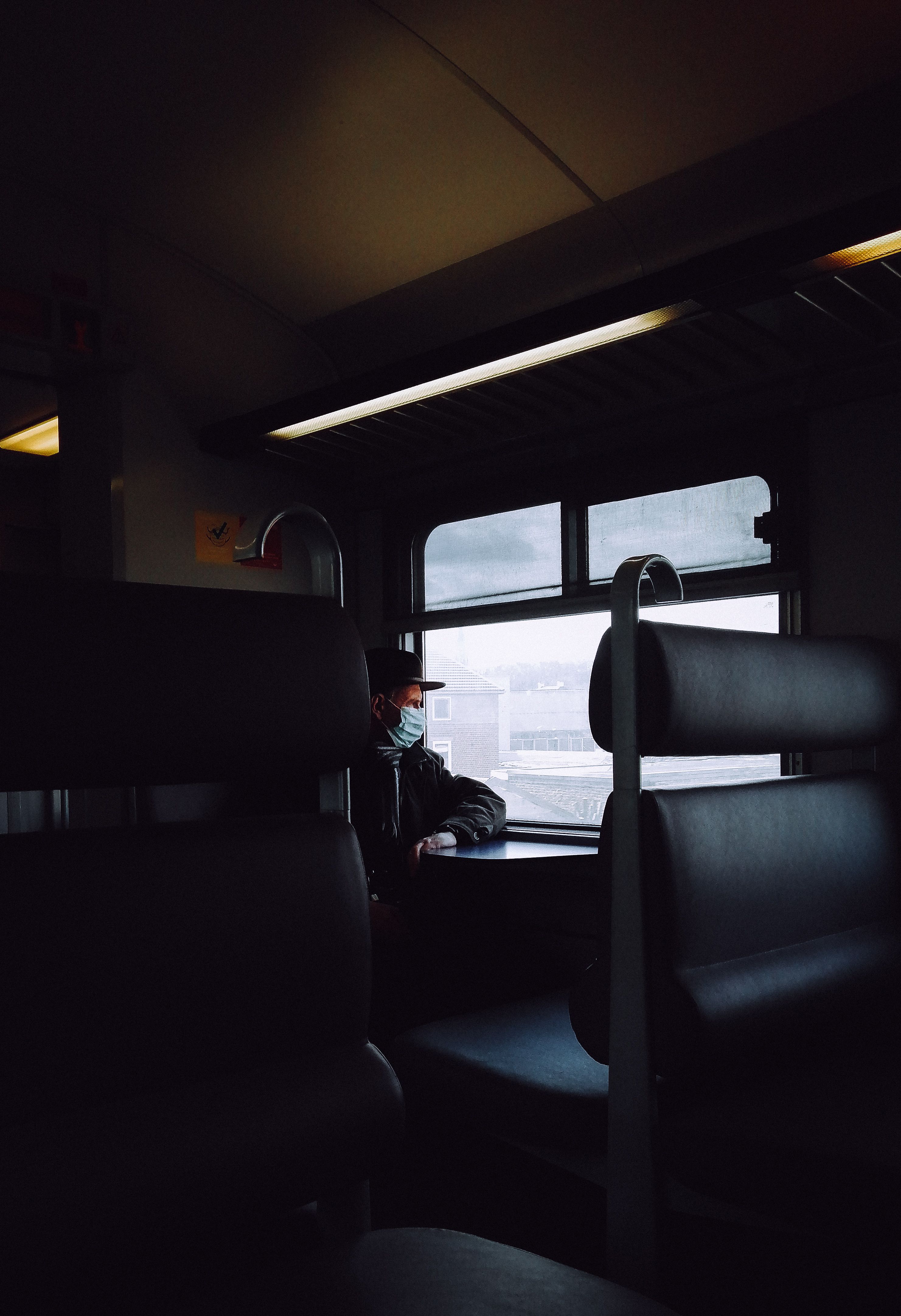Passenger in a Face Mask on the Train · Free Stock Photo