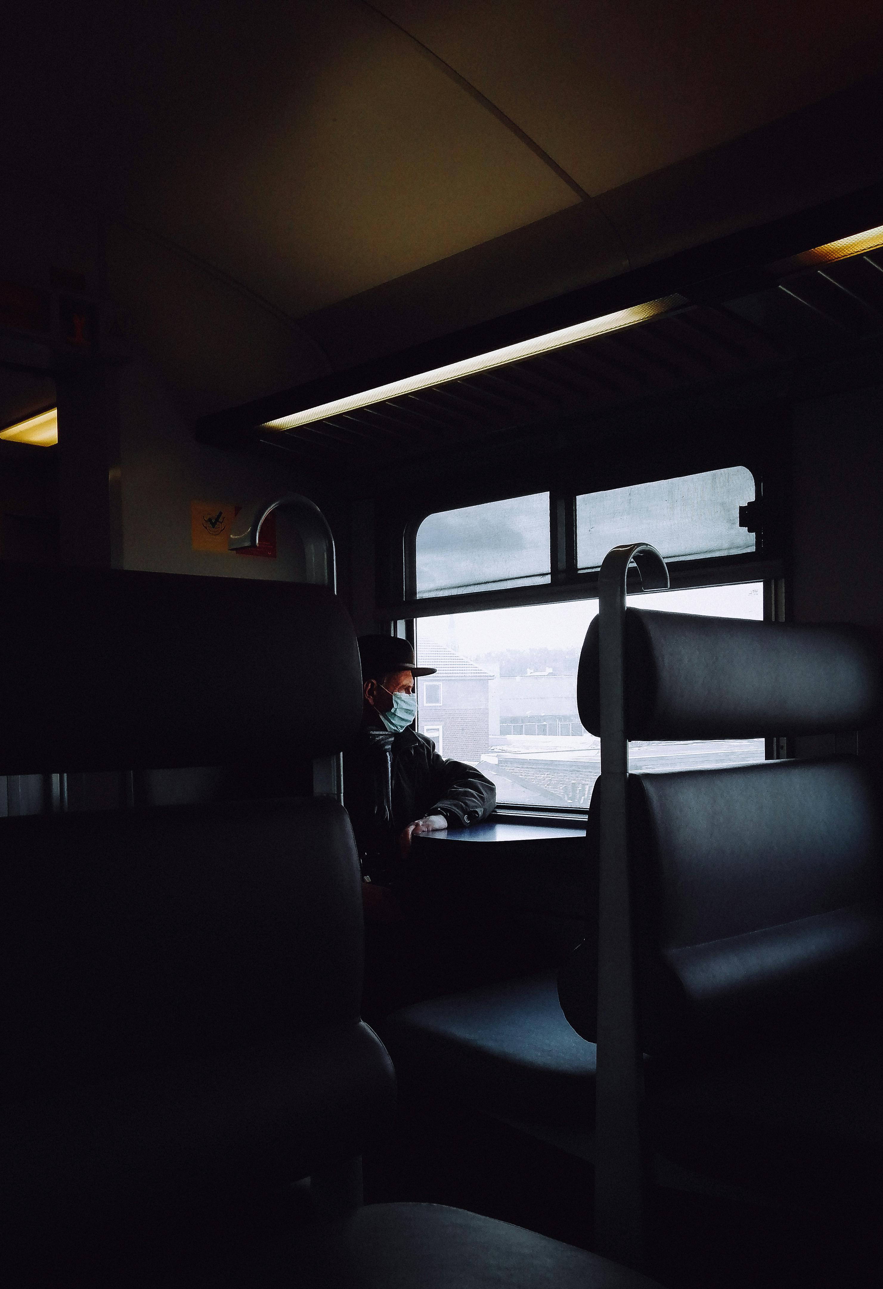 Woman Looking through a Train Window · Free Stock Photo