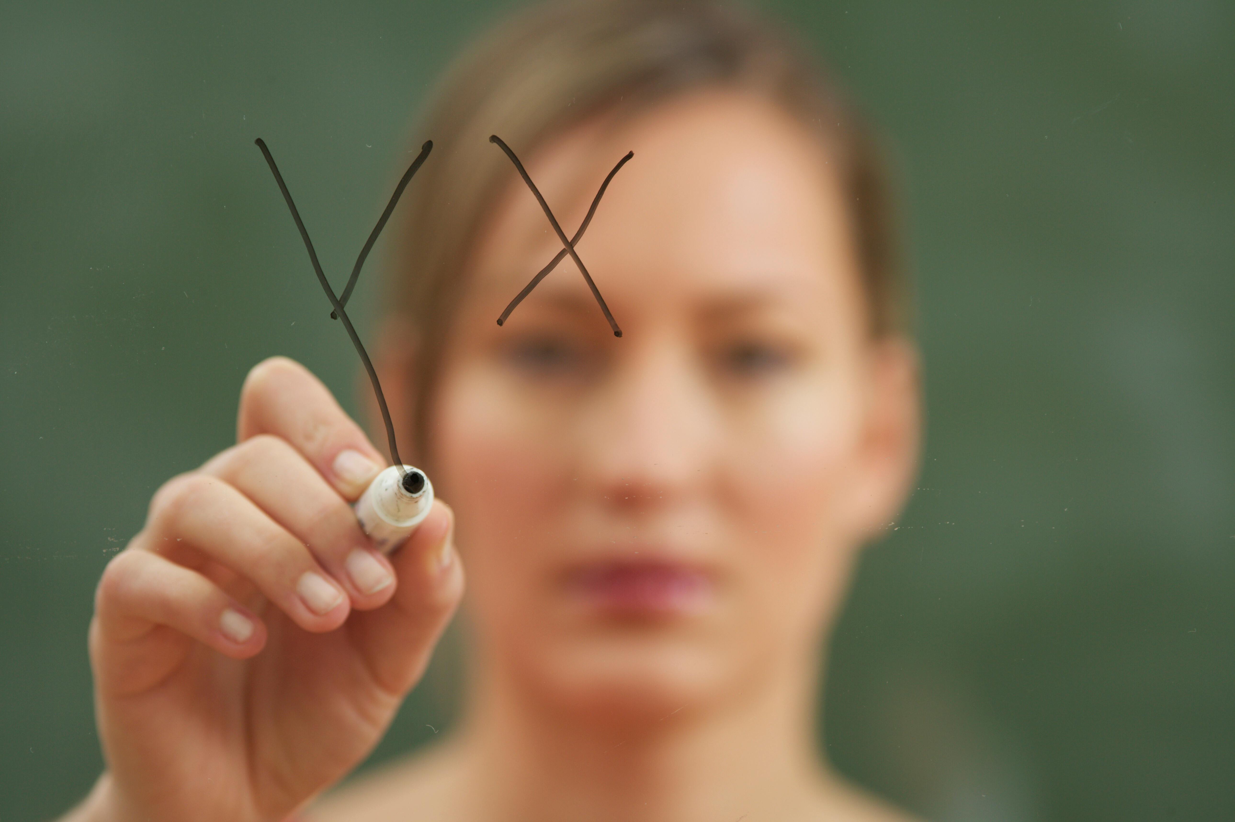 Woman Writing on the Glass with a Marker · Free Stock Photo