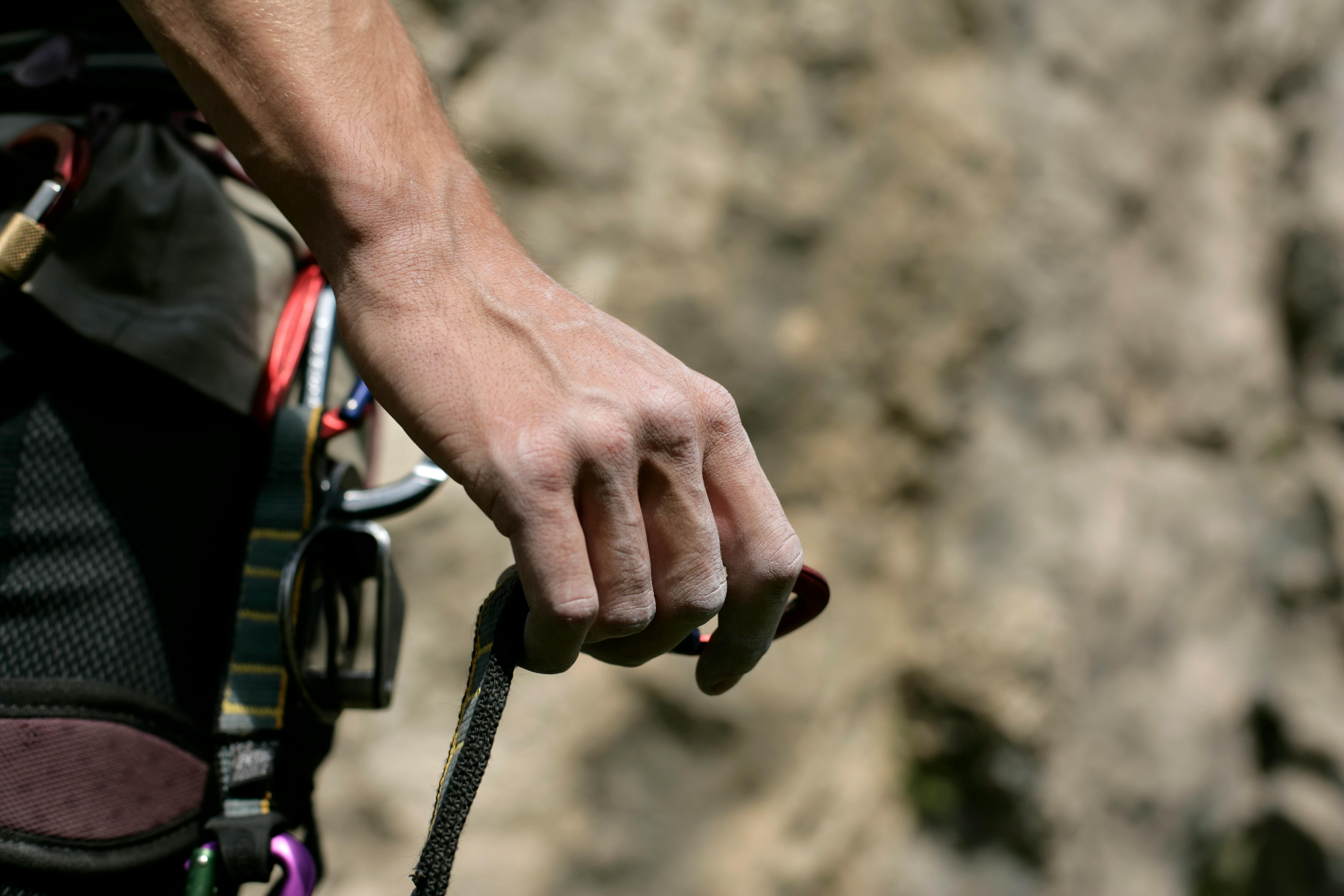 Man Tying Rope Around his Waist · Free Stock Photo