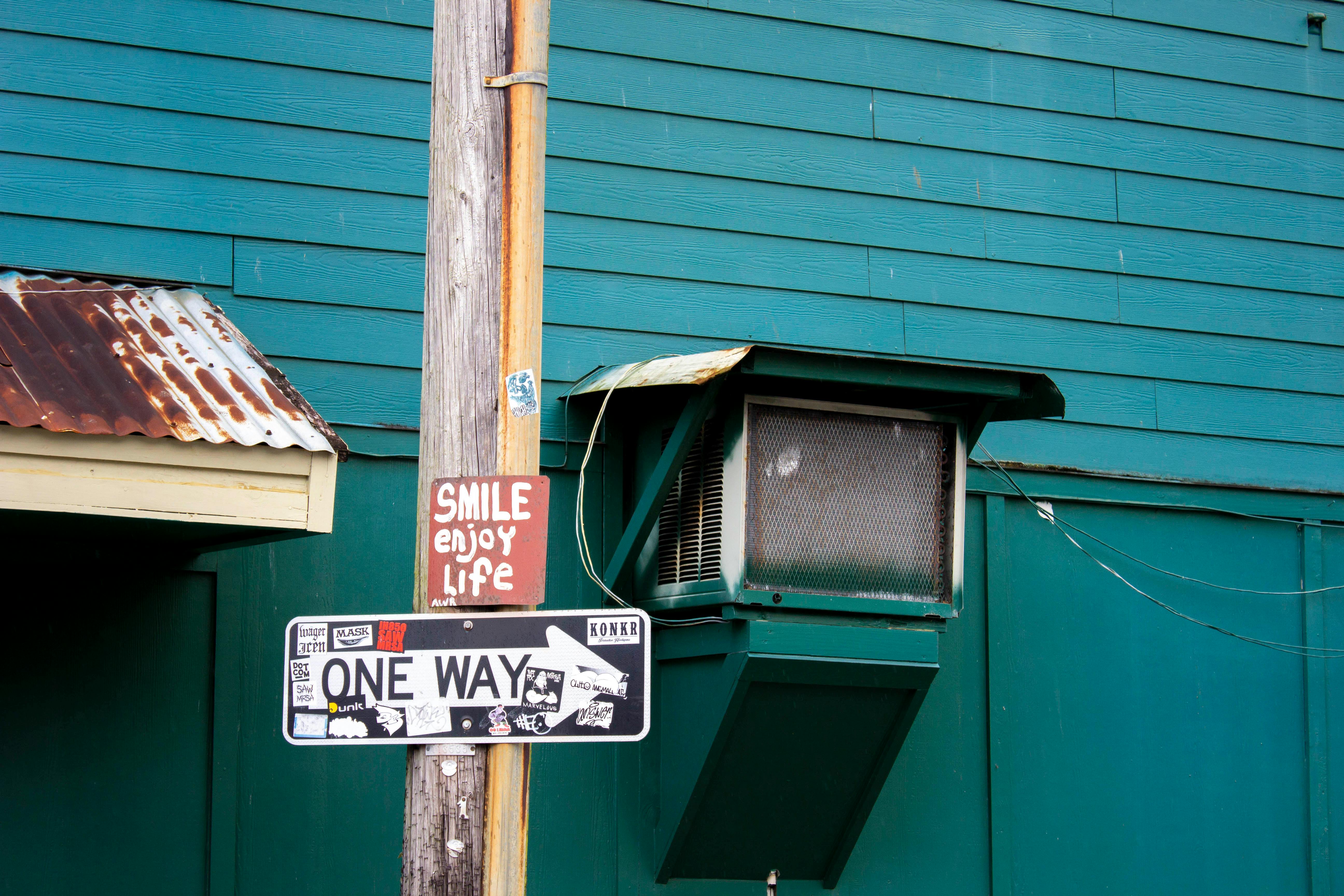 Road Sign on Brown Wooden Post · Free Stock Photo