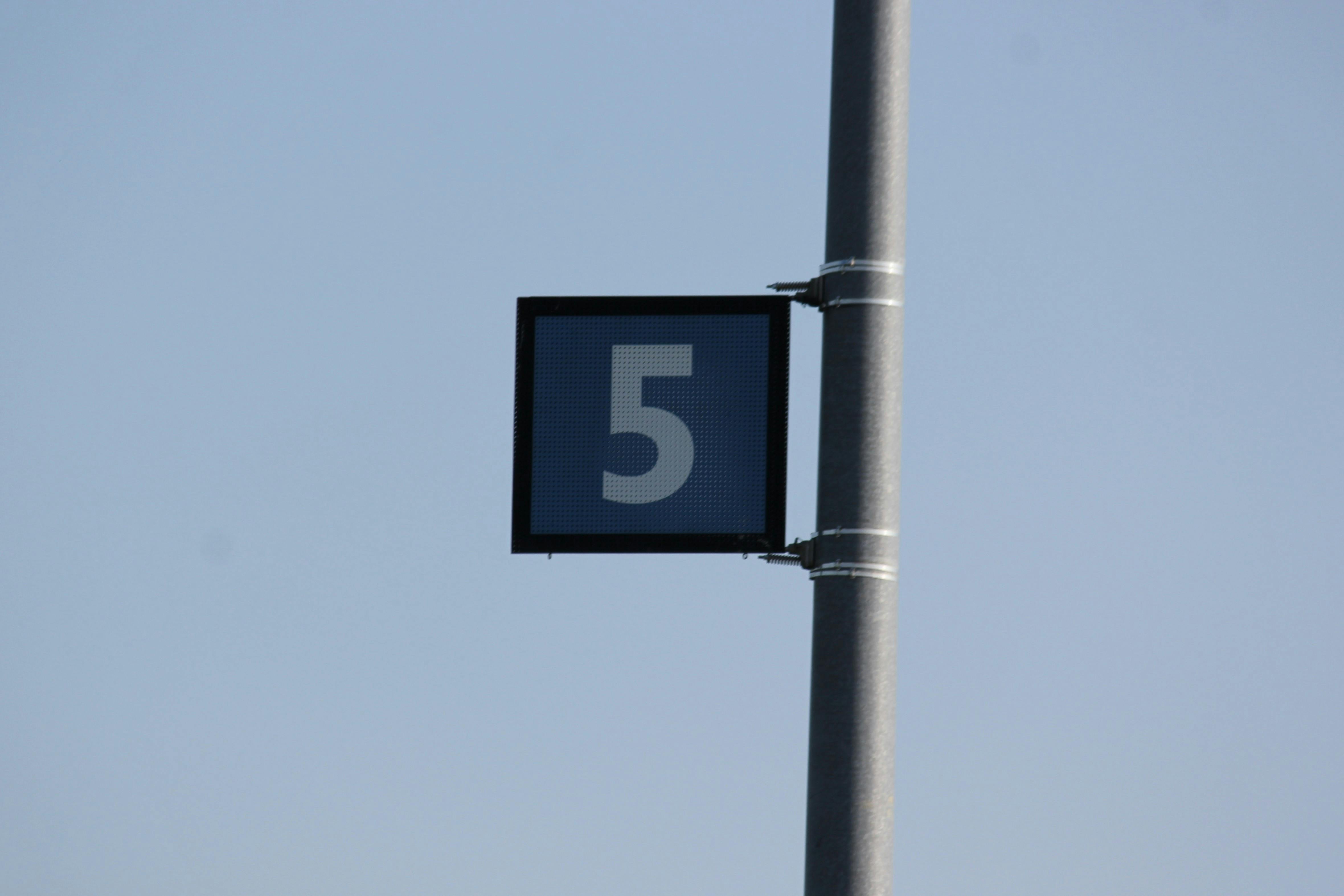 Blue and White Signage on Metal Post · Free Stock Photo