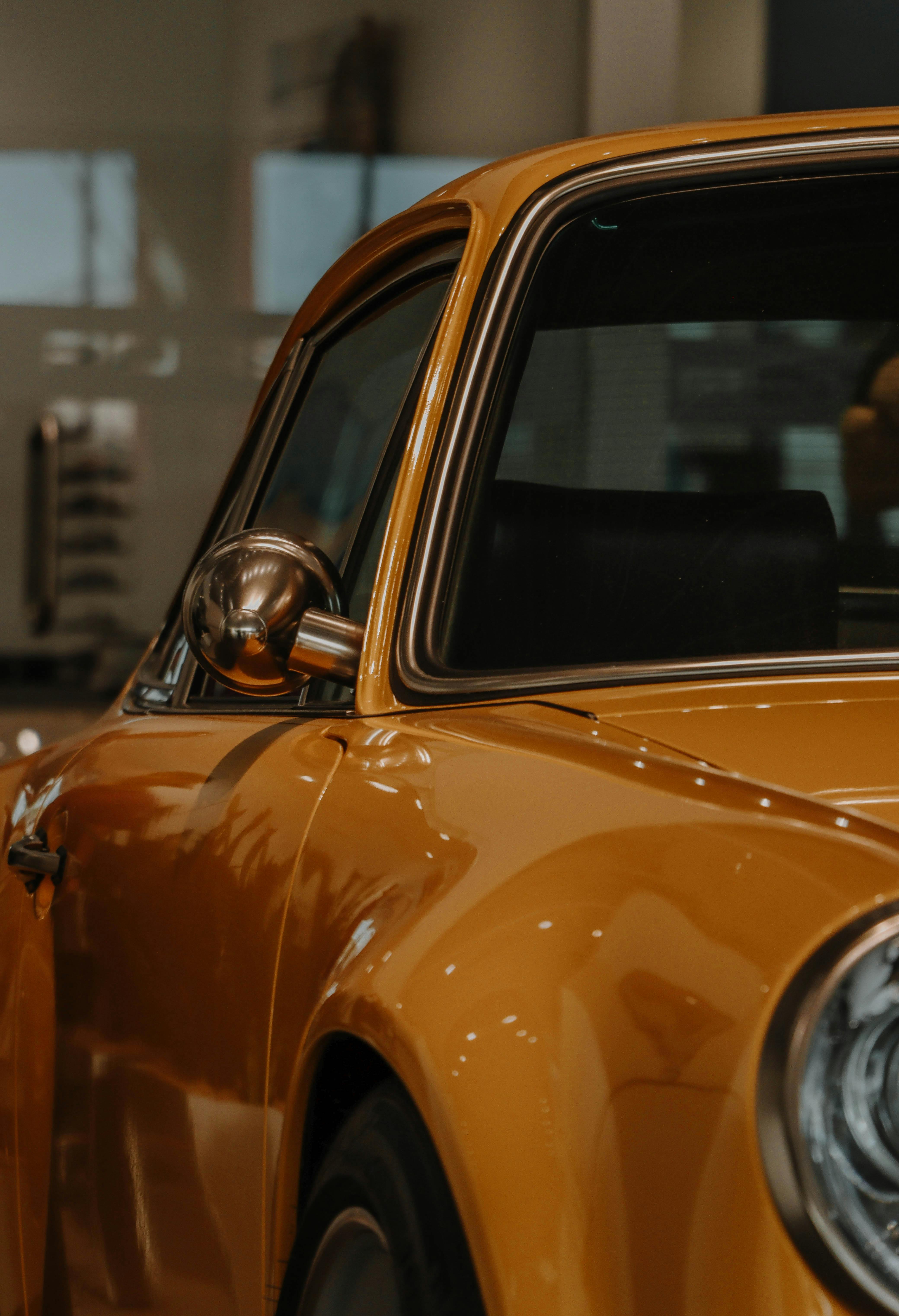 Close Up Photo of a Classic Yellow Car · Free Stock Photo