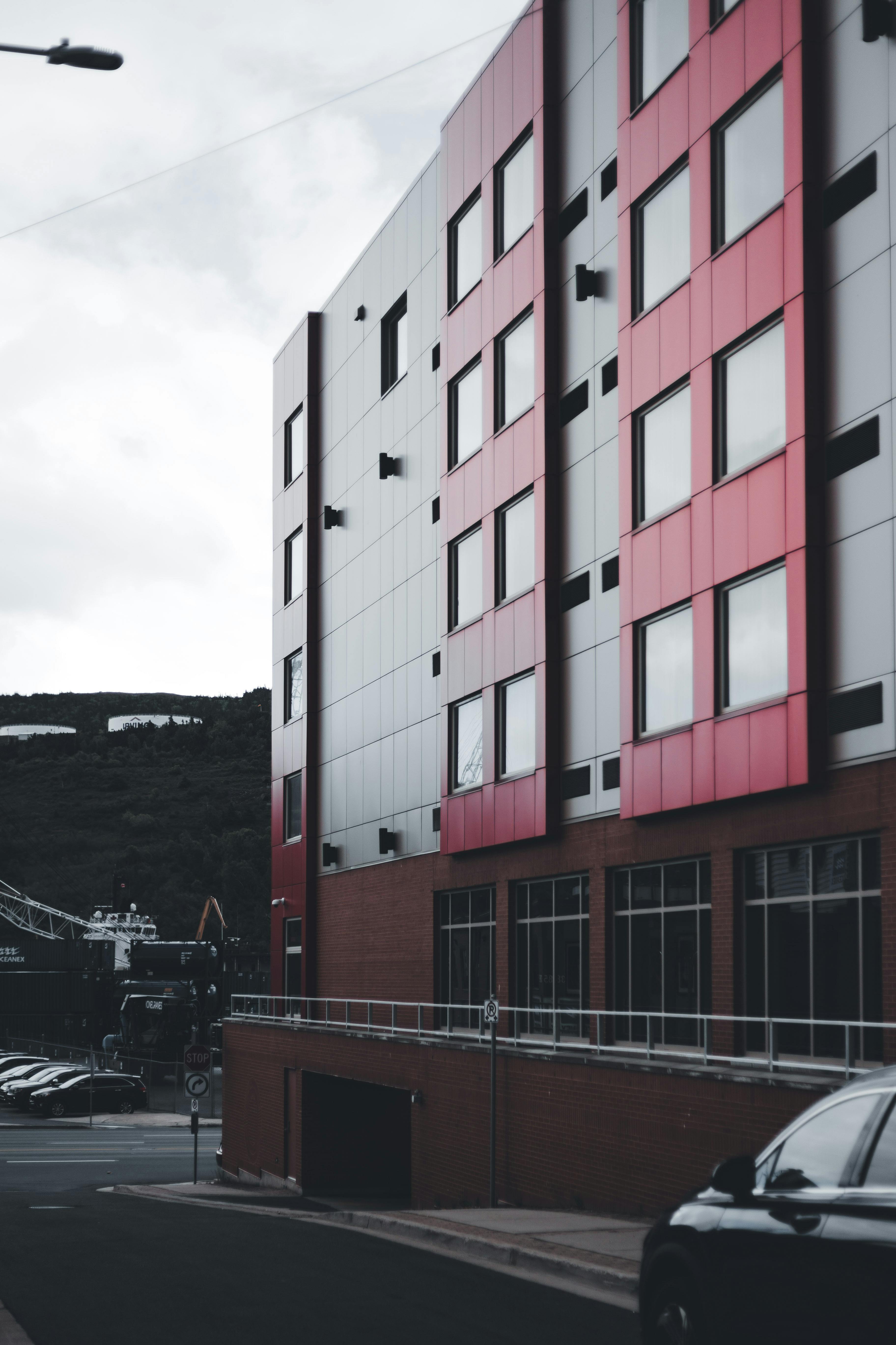 White and Red Concrete Building · Free Stock Photo