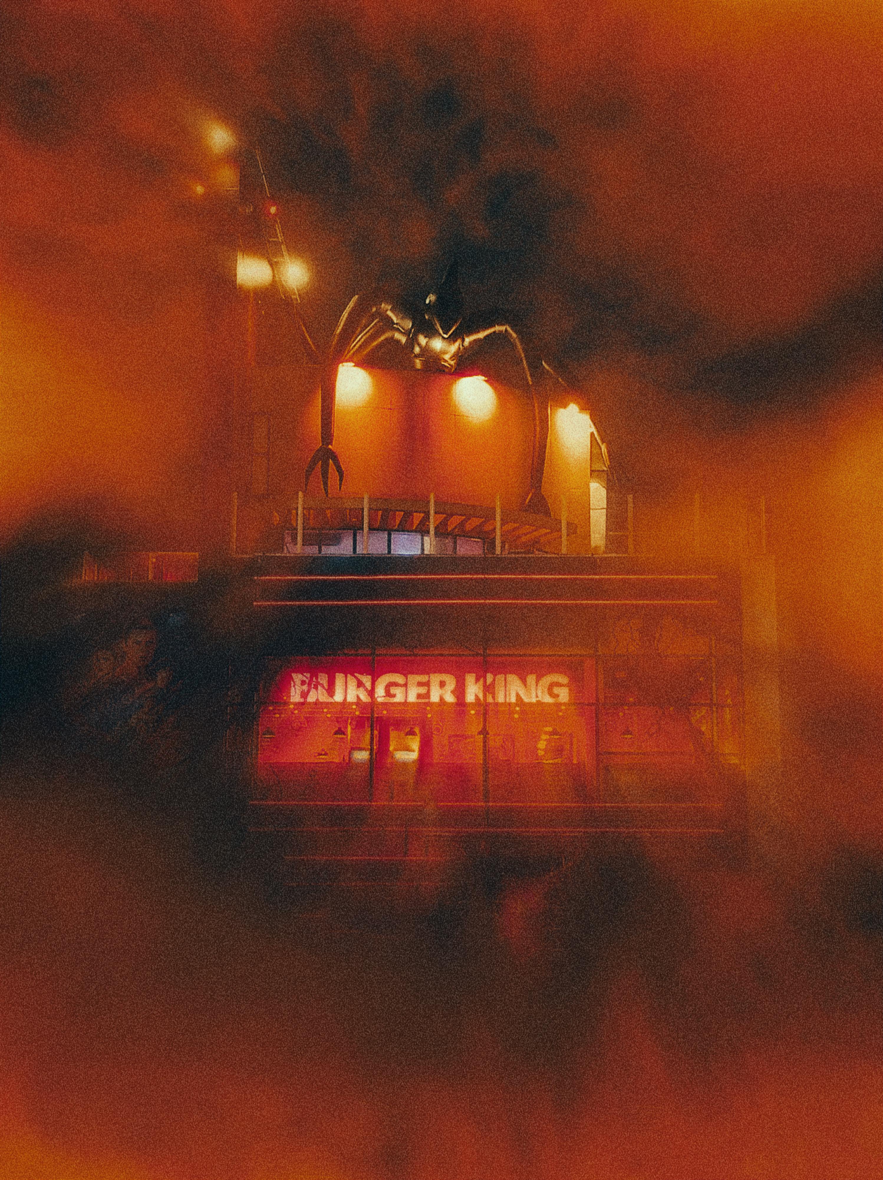 Billboard With a 3D Monster Looming Over a Fast Food Restaurant at ...