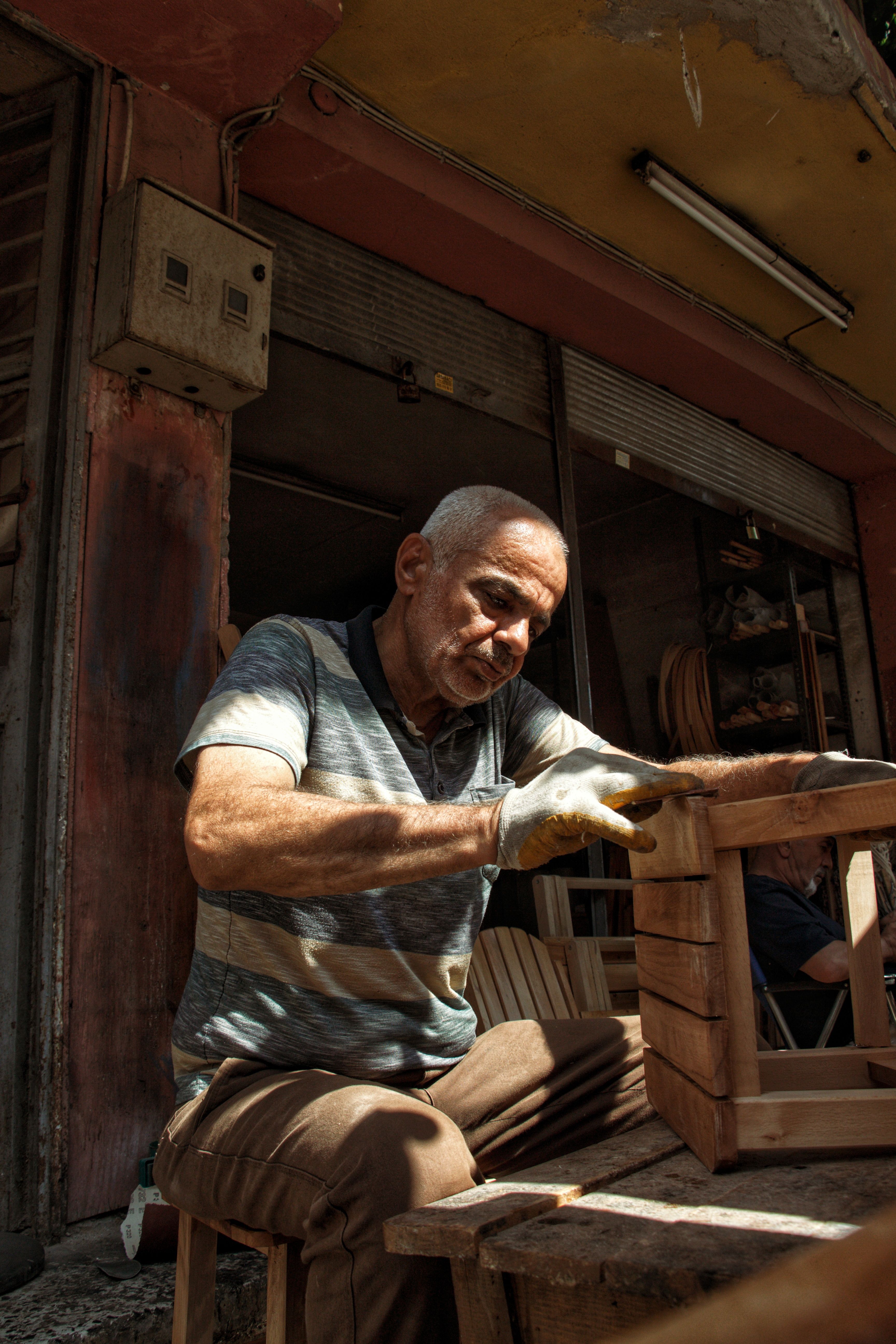 Carpenter Making a Wooden Stool · Free Stock Photo