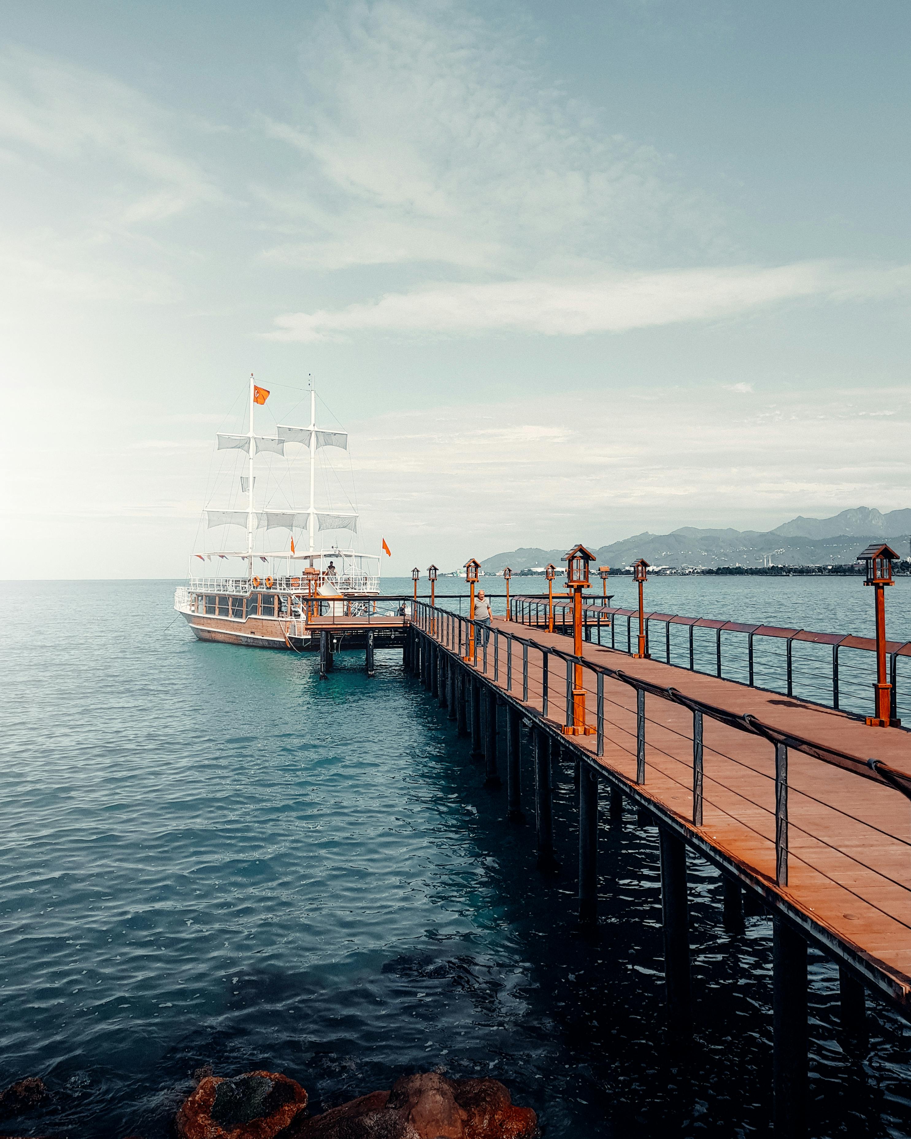 Faint Silhouette of Ship Sailing on Horizon · Free Stock Photo