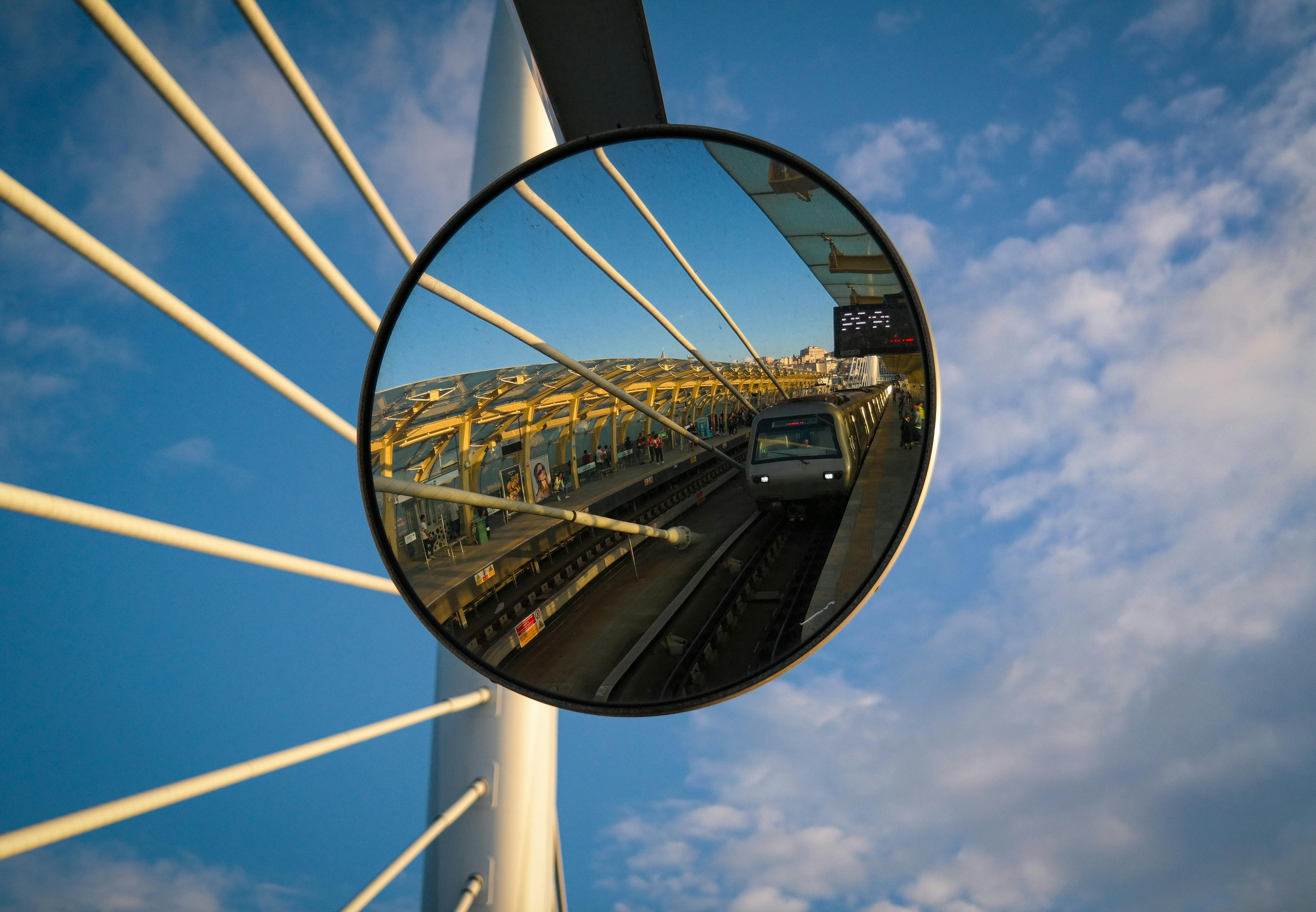Mirror with the Reflection of a Train · Free Stock Photo