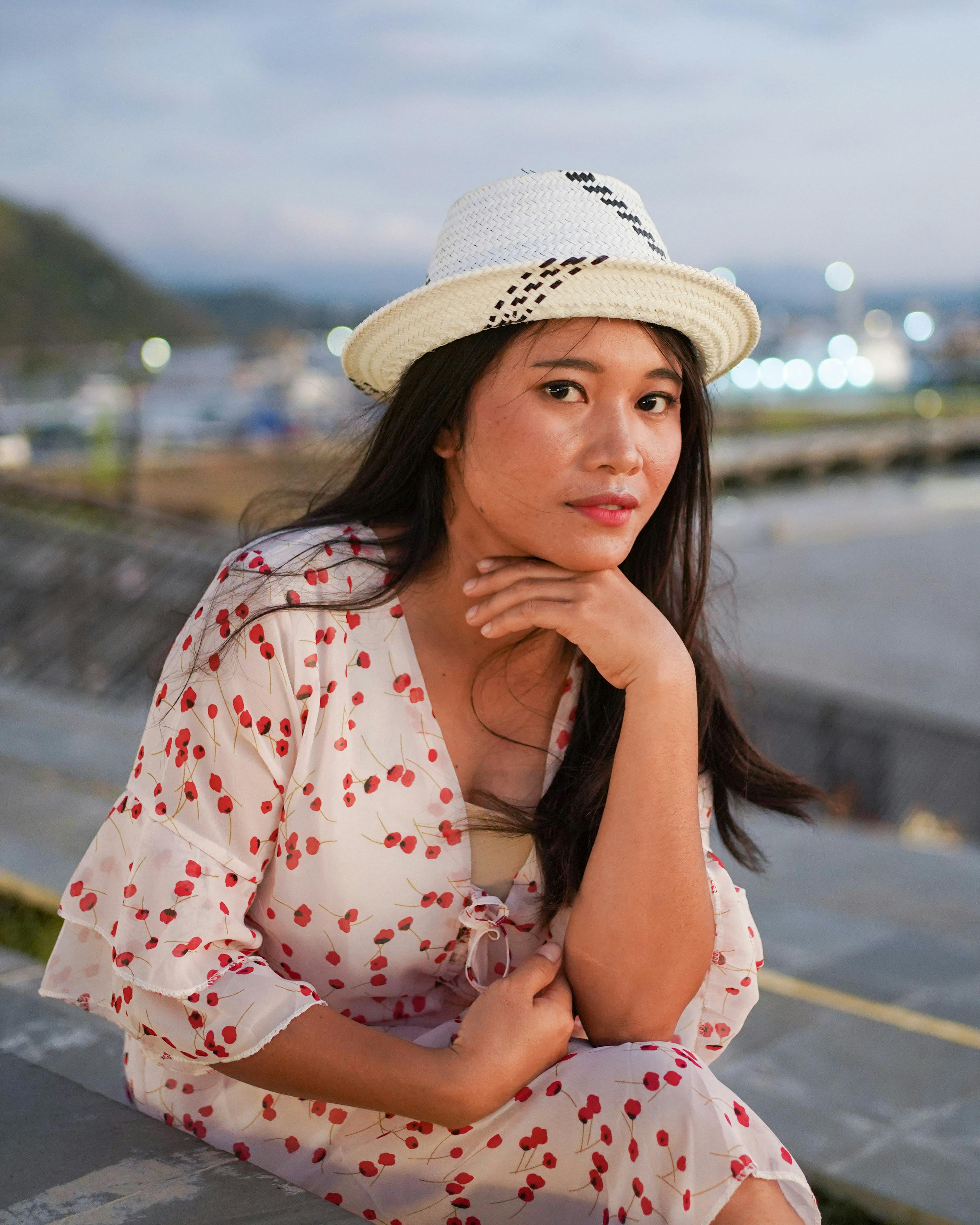 A Woman Pointing her Chin · Free Stock Photo