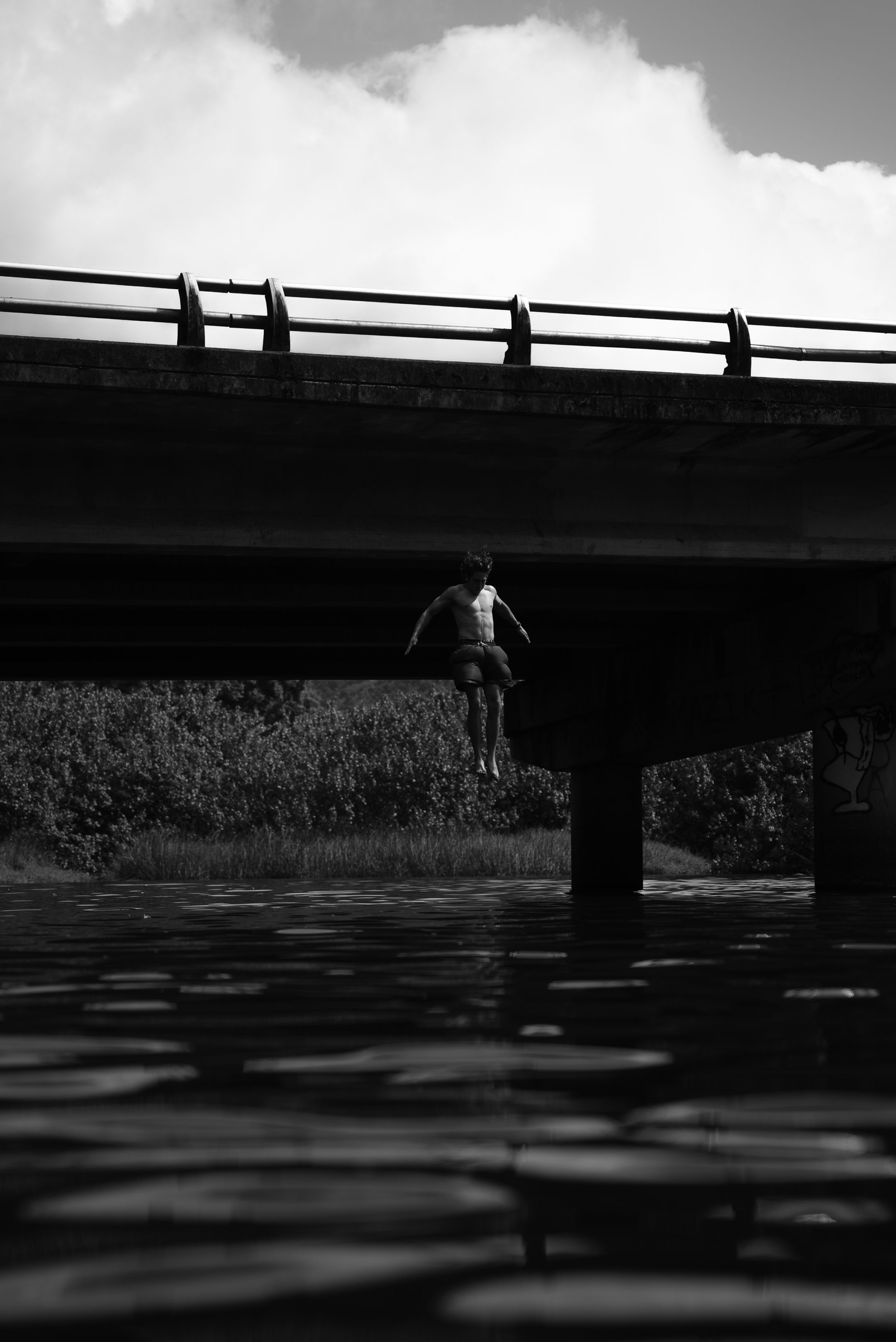 Man Jumping to Water from Bridge · Free Stock Photo