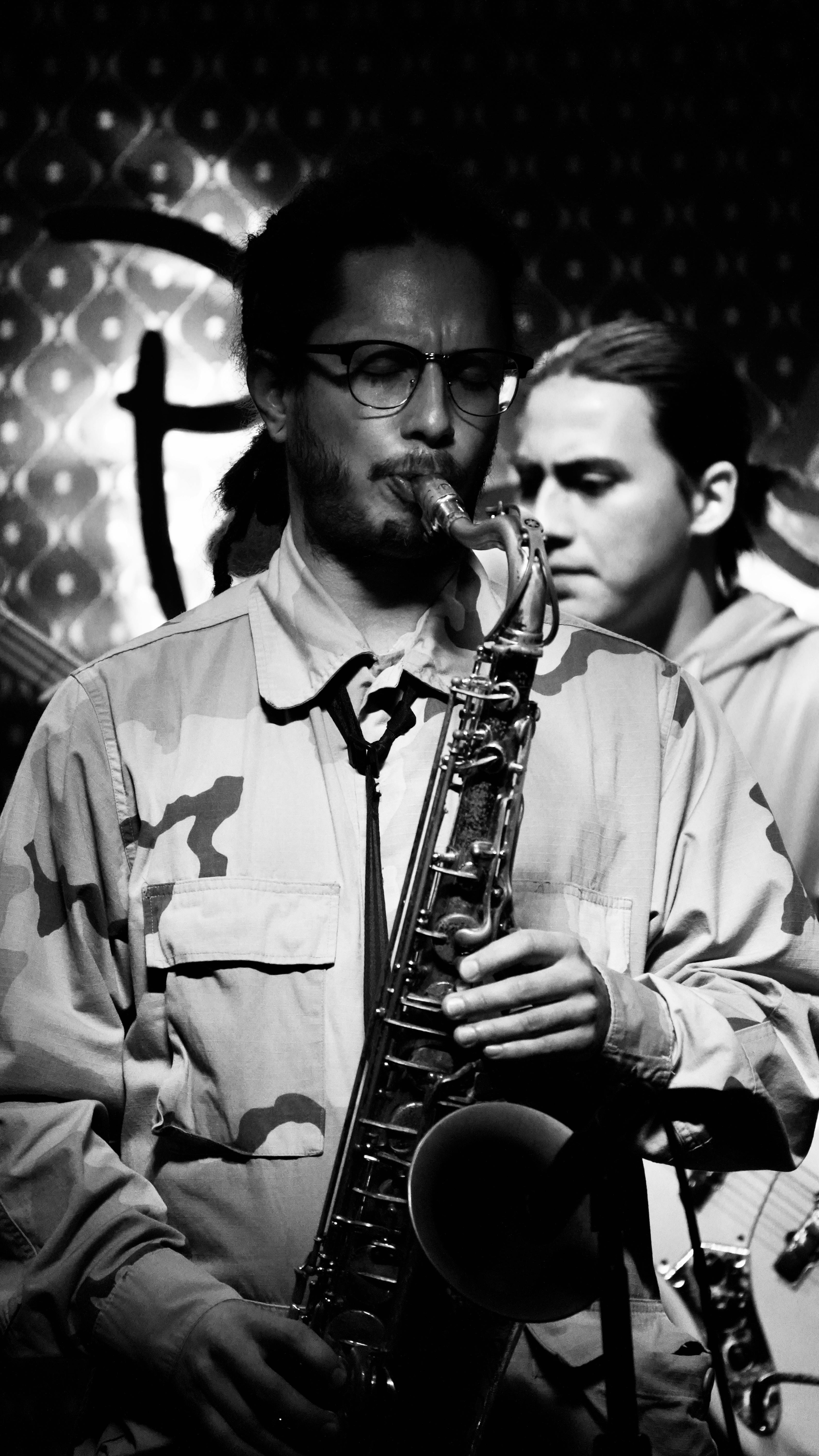 Grayscale Photo of man Playing Saxophone · Free Stock Photo