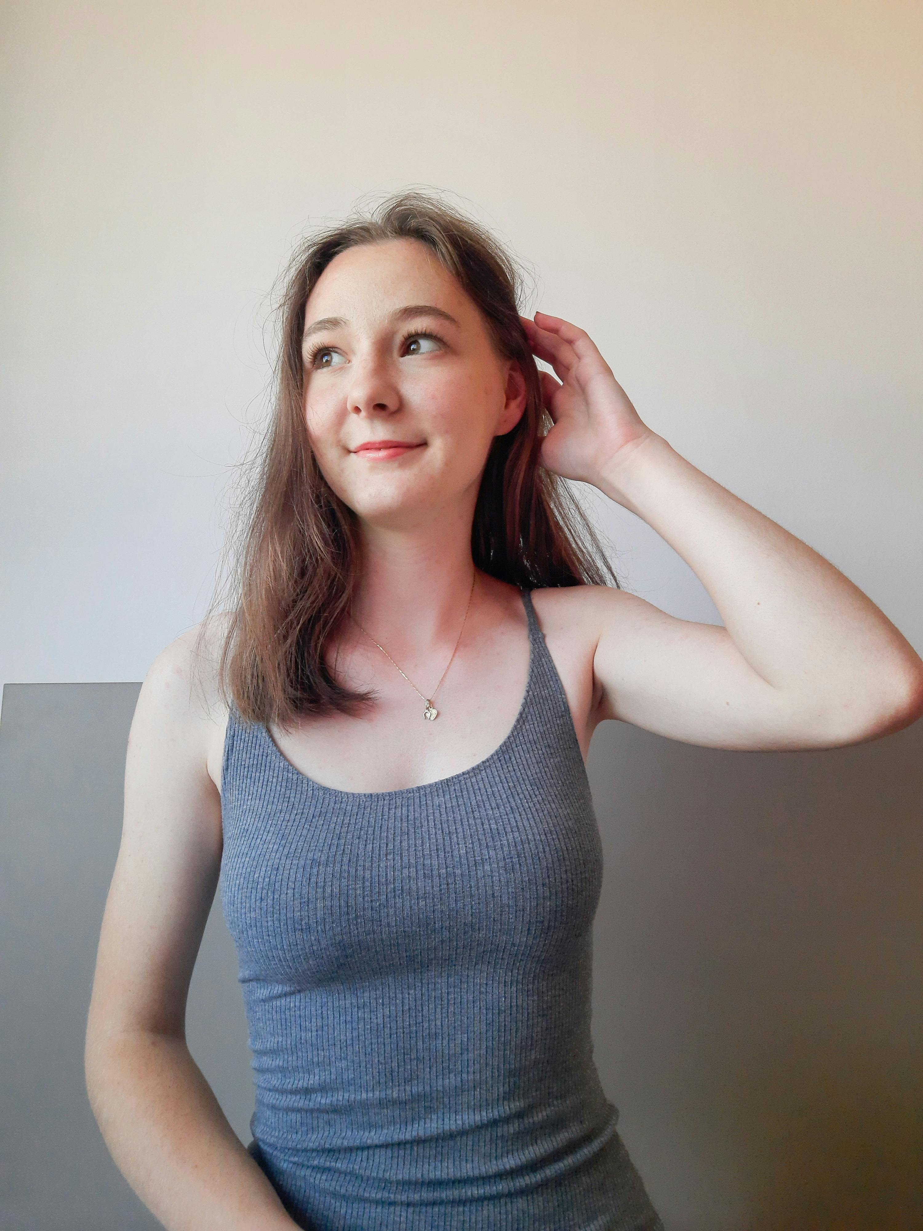 A Portrait of a Woman Wearing a Tank Top · Free Stock Photo