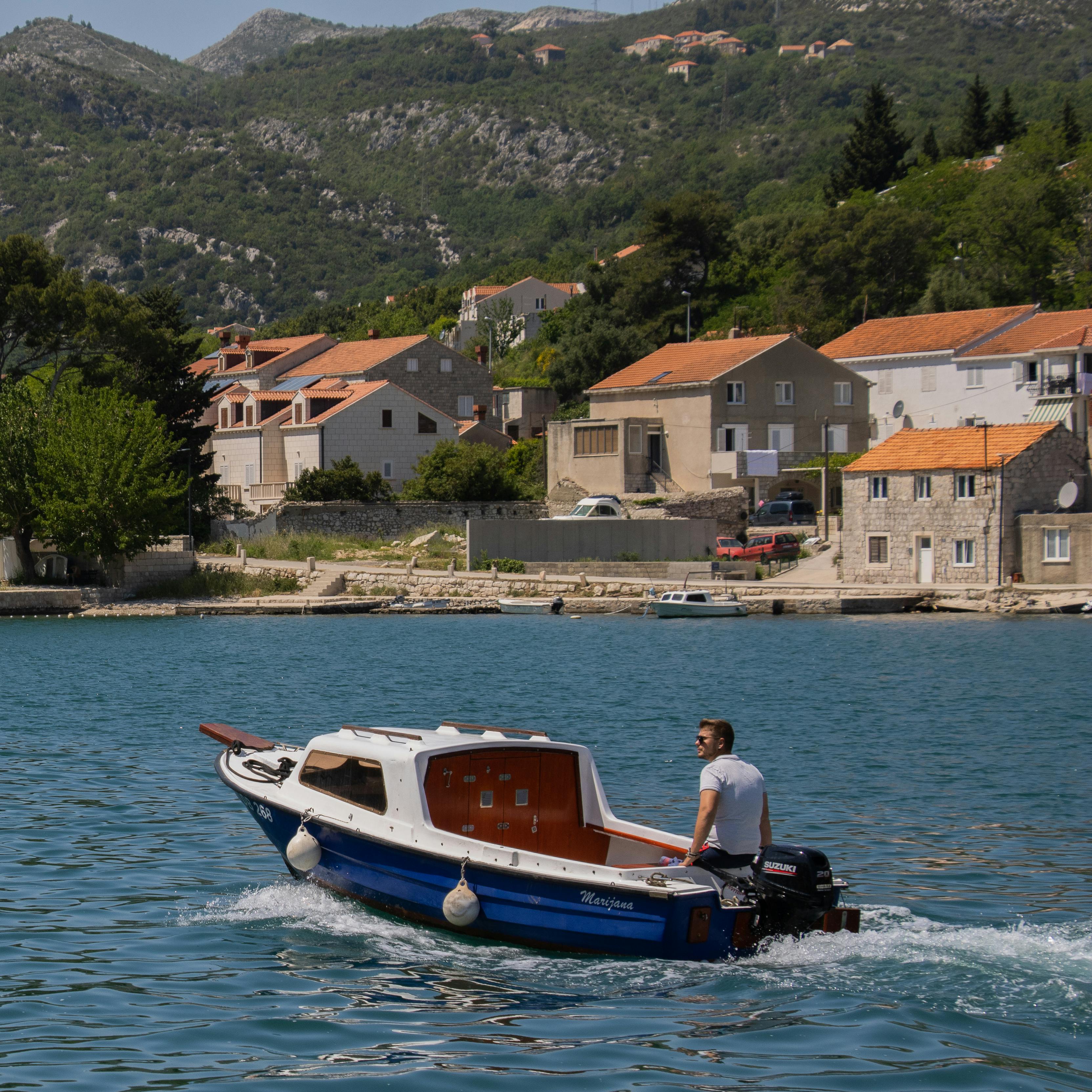A Man Riding a Boat · Free Stock Photo