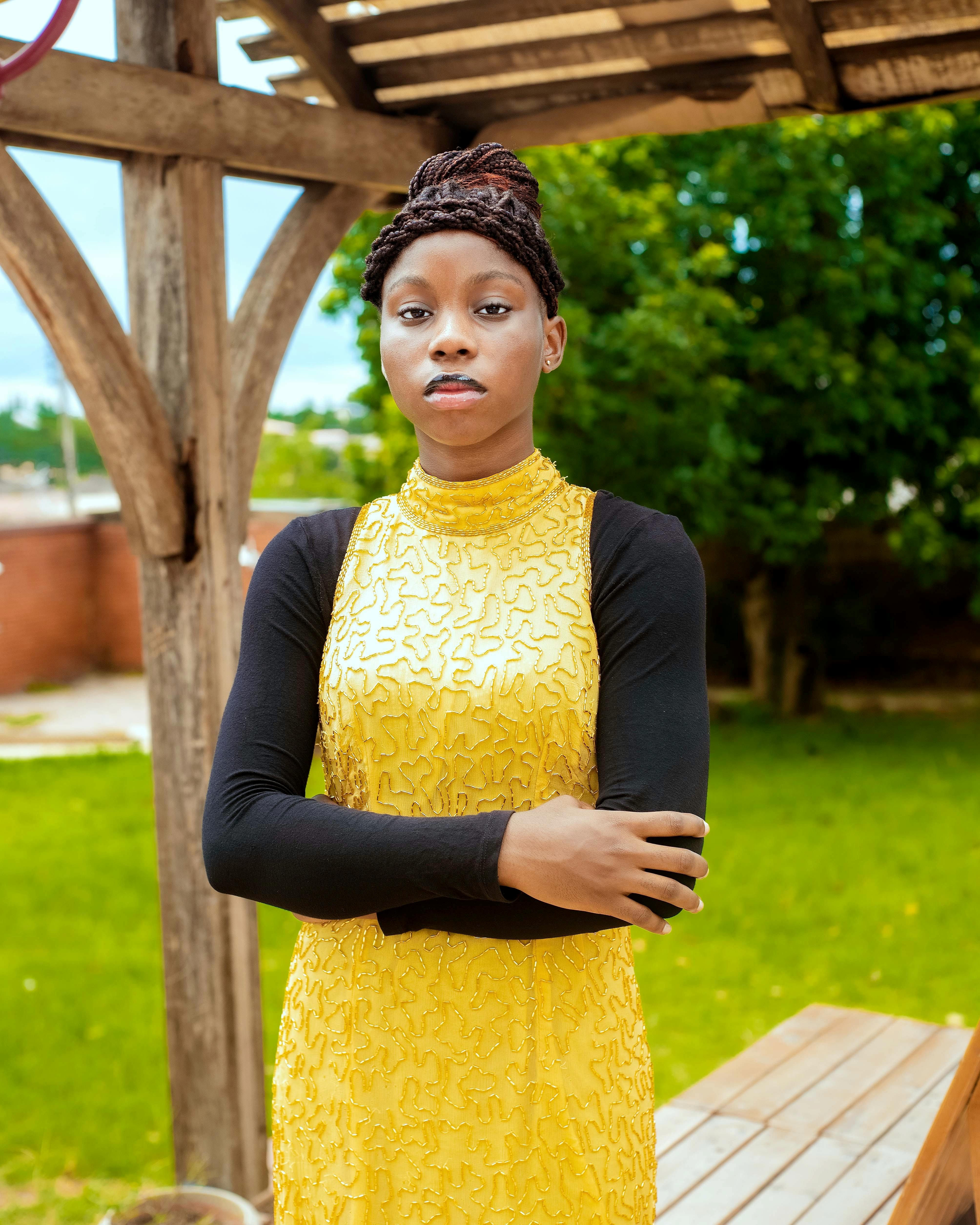 A Person with Crossed Arms and Legs · Free Stock Photo