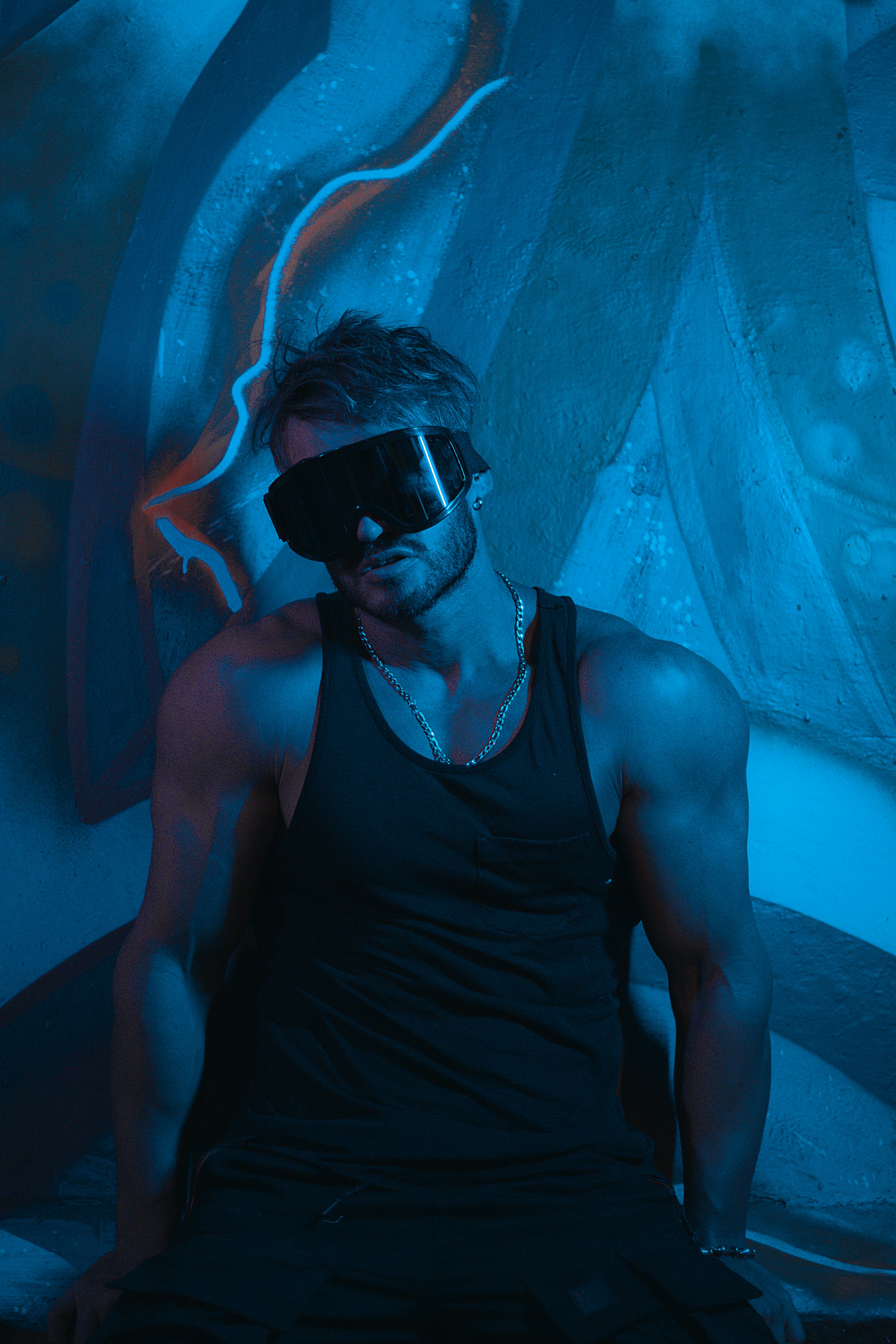 Woman Sitting in Blue Light at Club · Free Stock Photo