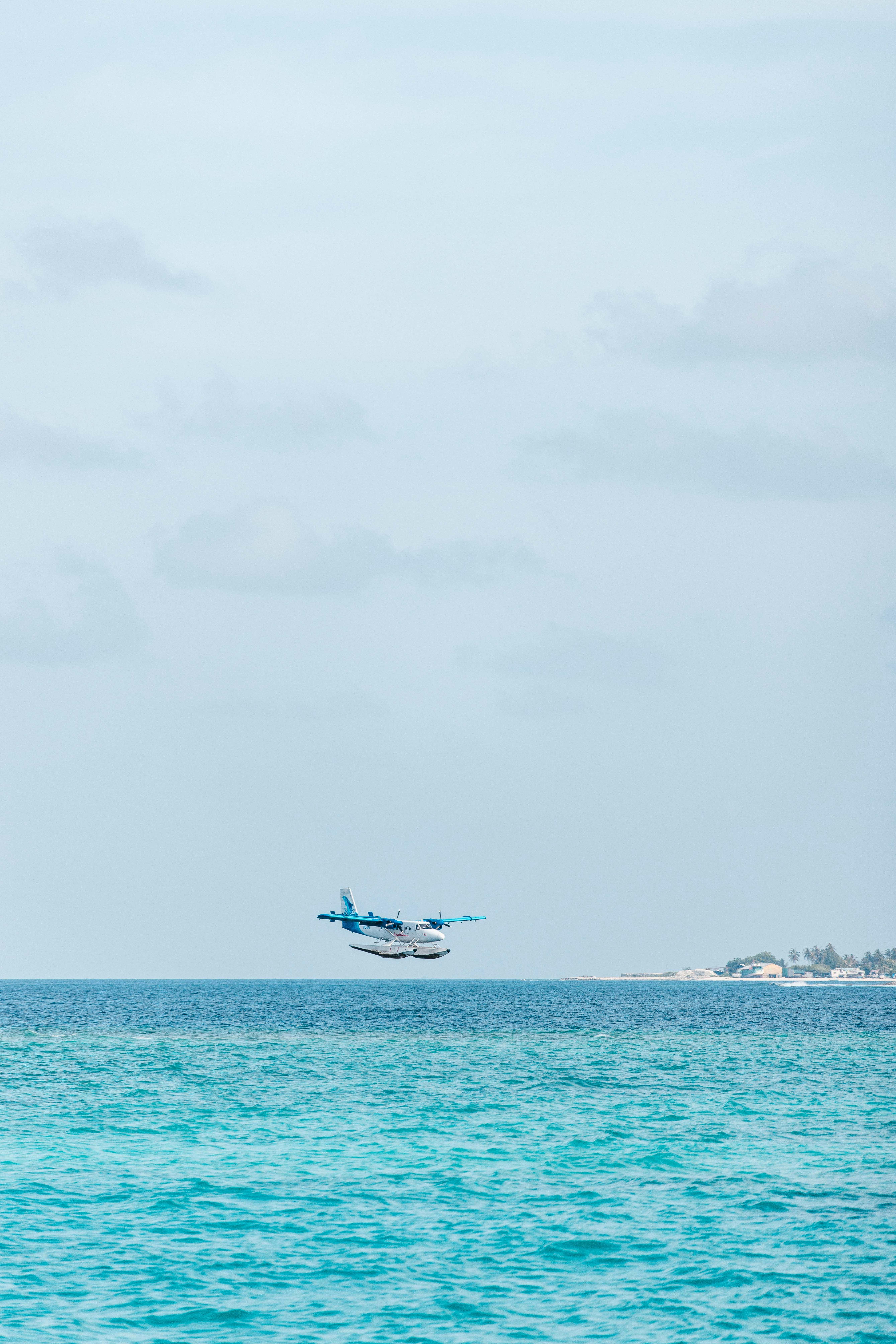 Airplane Over the Sea · Free Stock Photo