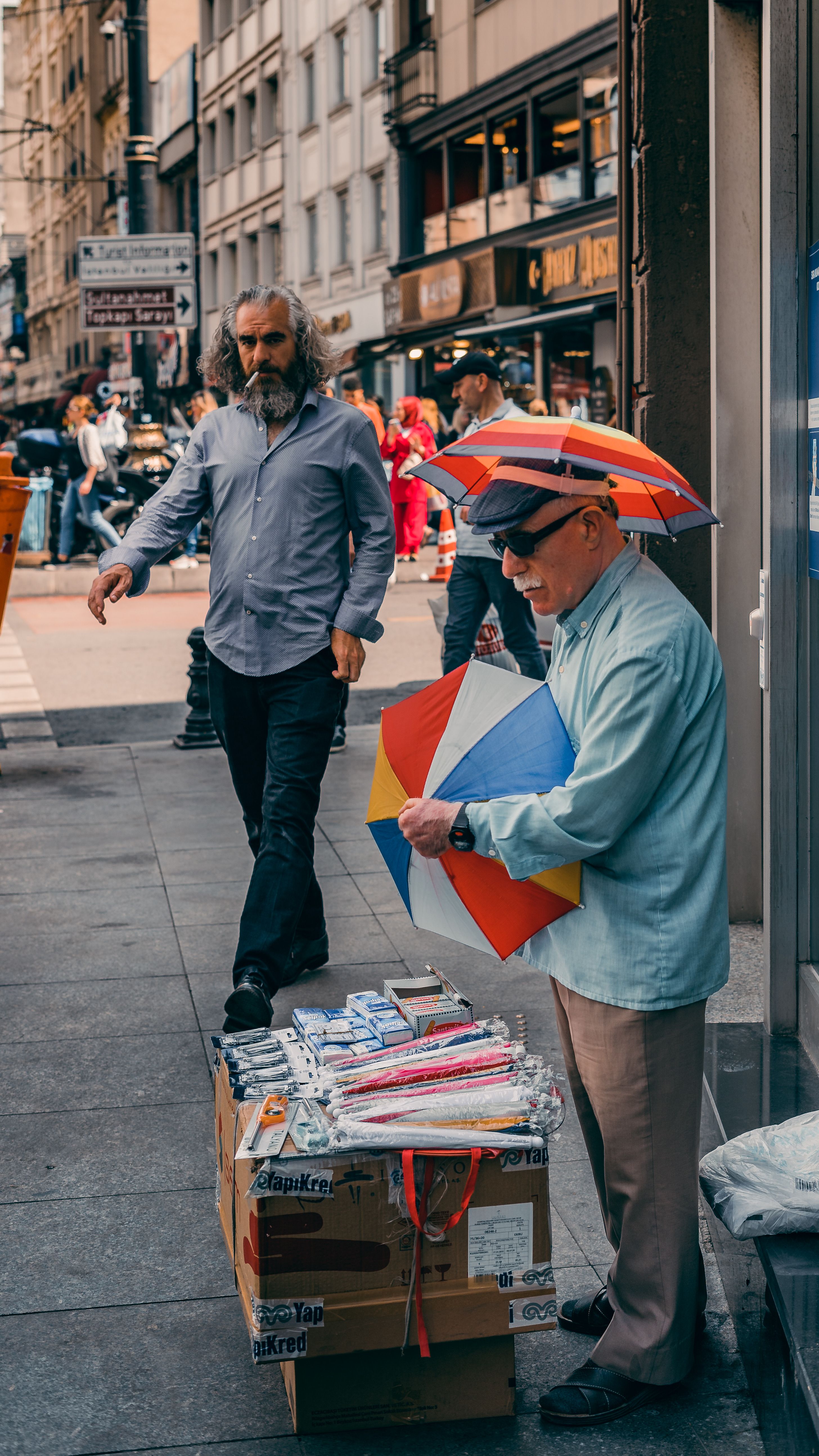 Elderly Man Selling Souvenirs on a Street · Free Stock Photo