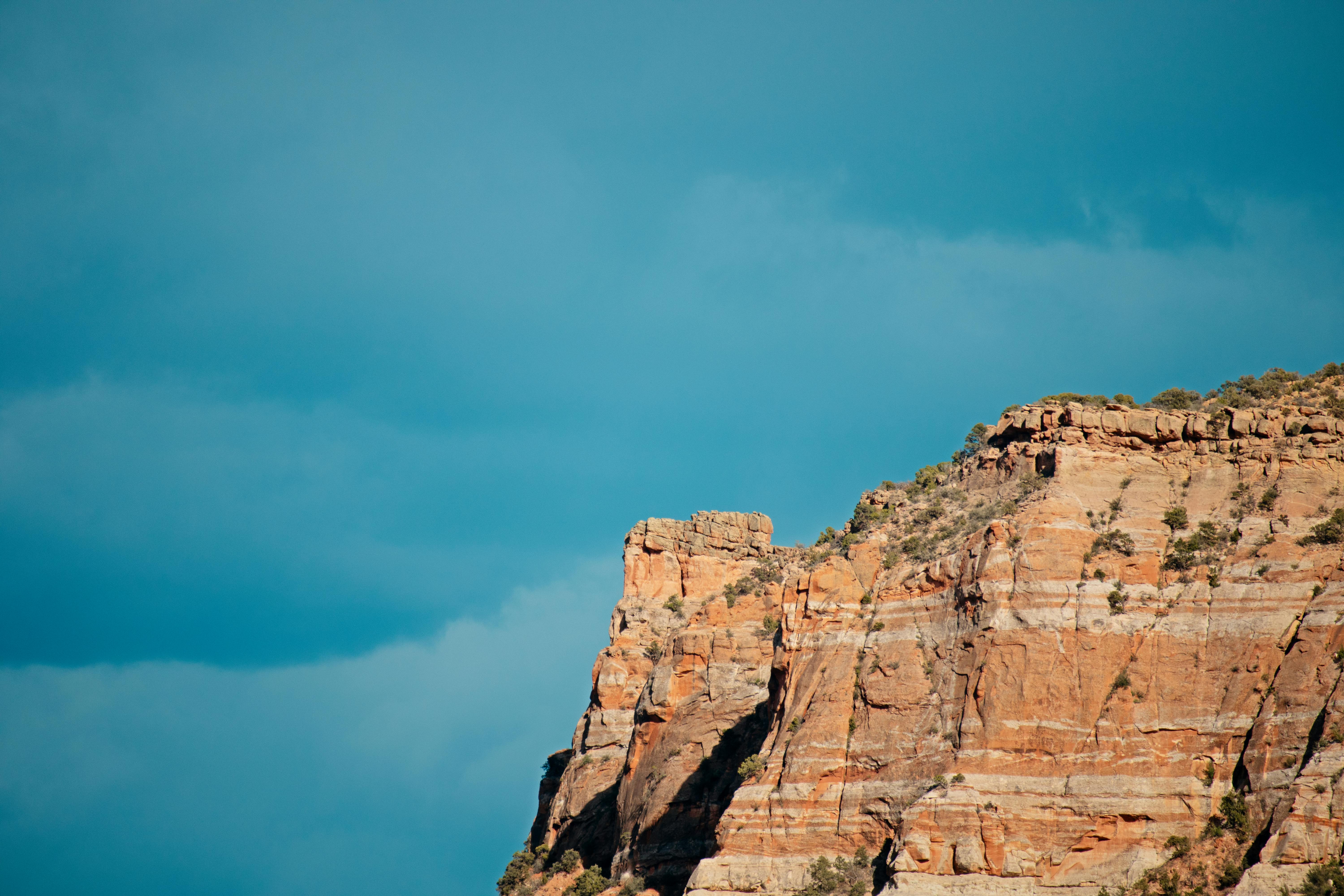 Brown Cliff Under Blue Sky · Free Stock Photo