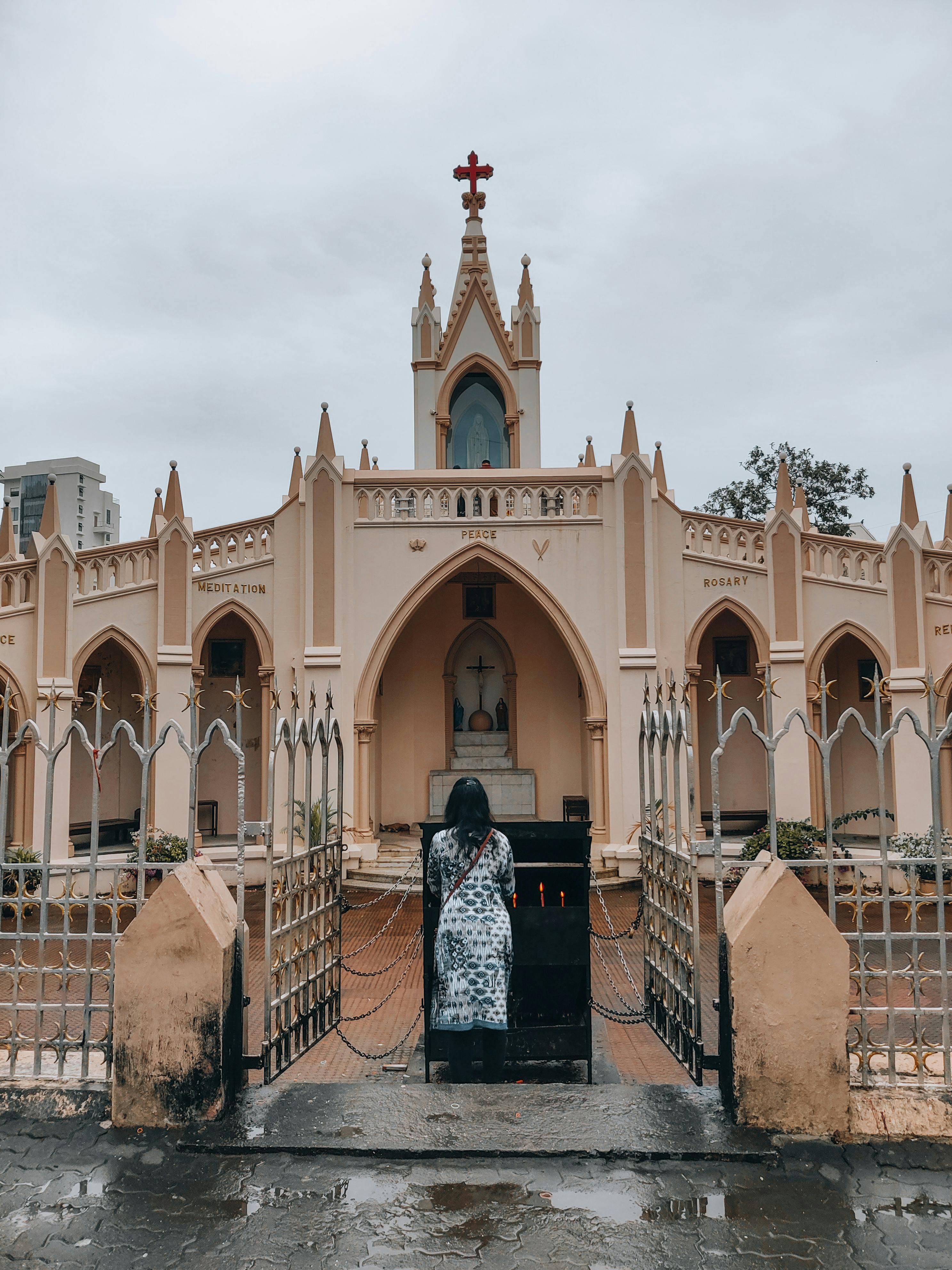 Woman Praying outside a Church · Free Stock Photo