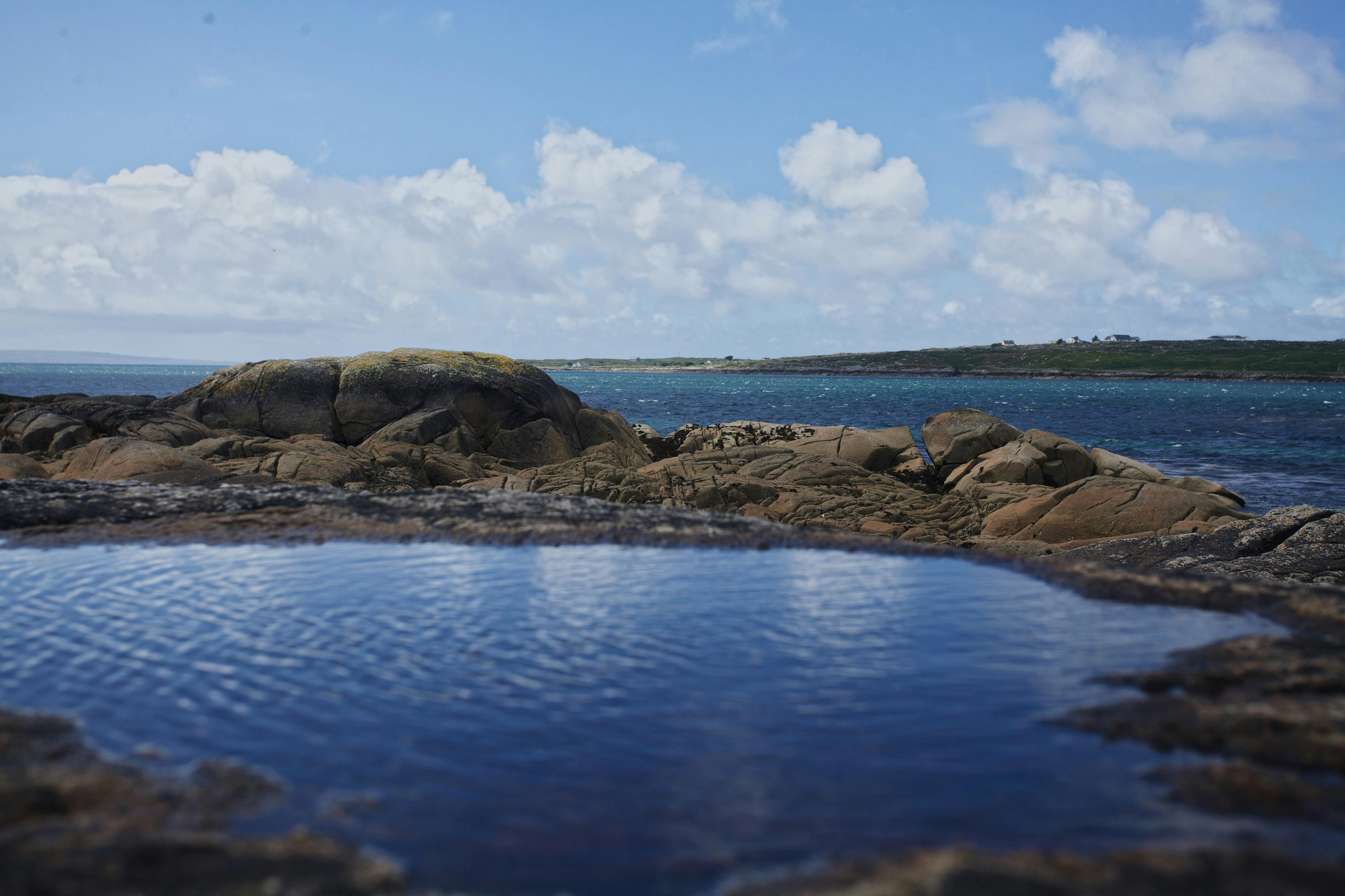 Photo of a Blue Ocean near Buildings · Free Stock Photo