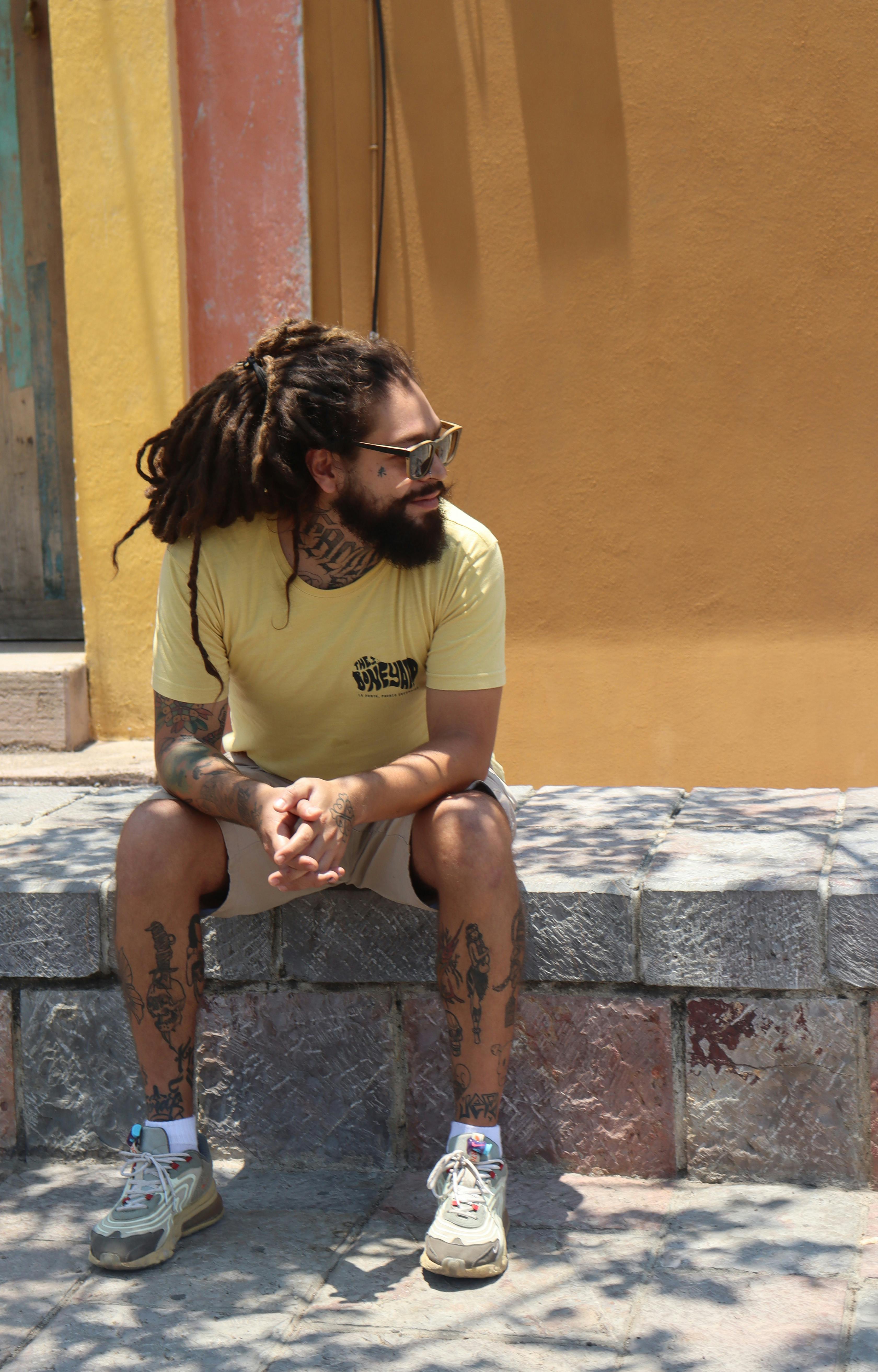 Photo of a Man with Dreadlocks Posing · Free Stock Photo