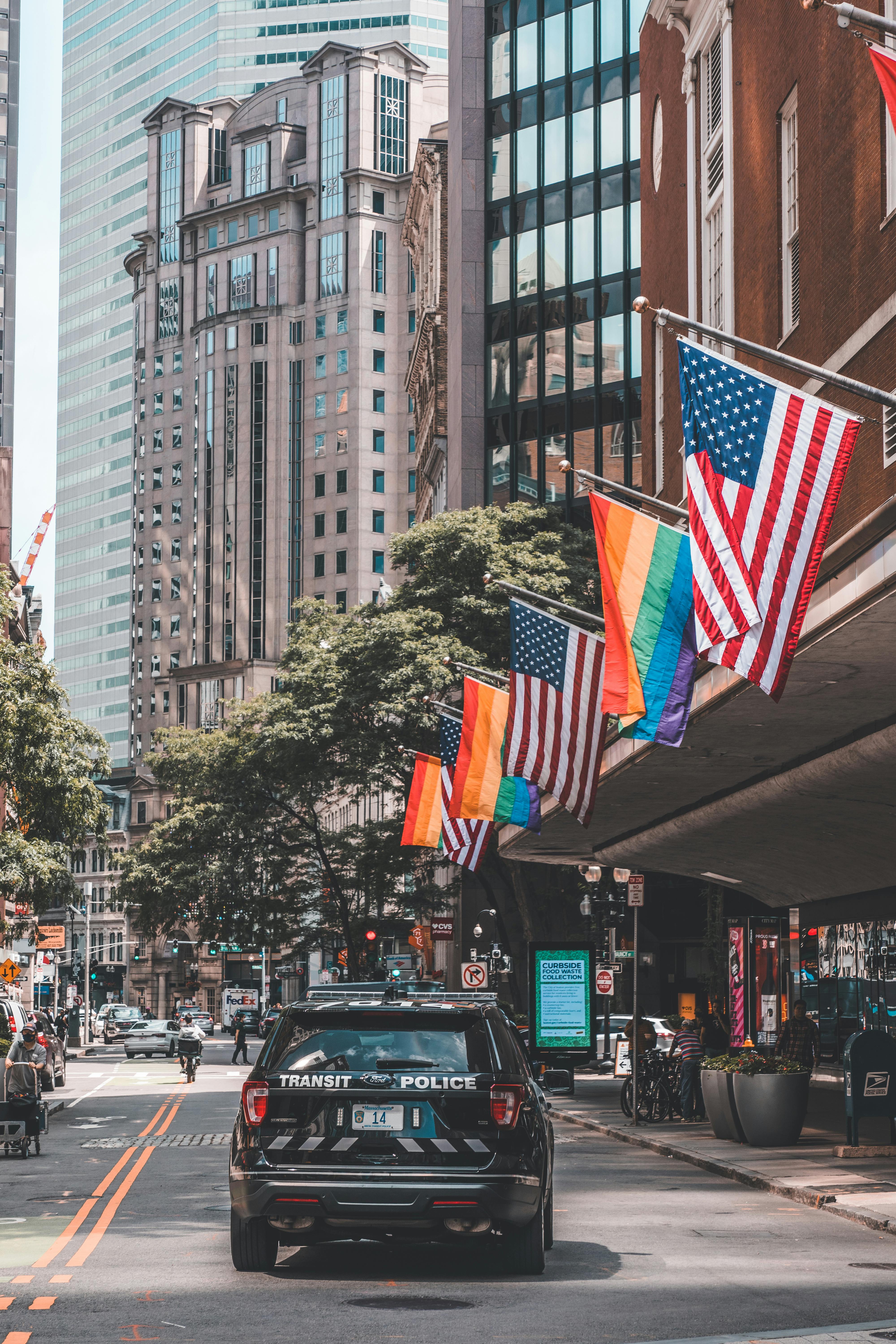 Flags Hanging Outside a Building · Free Stock Photo