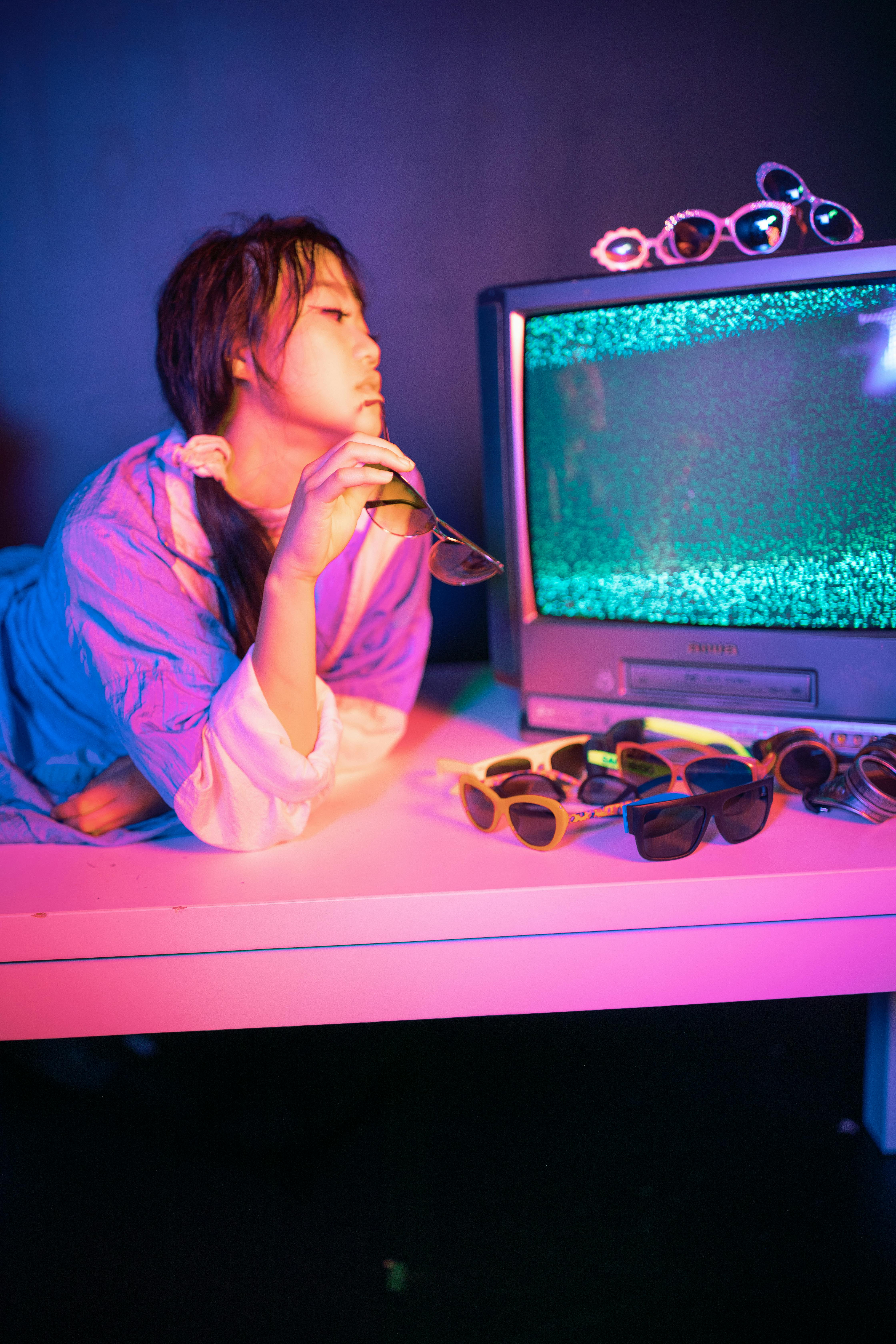 Girl Staring at a Television · Free Stock Photo