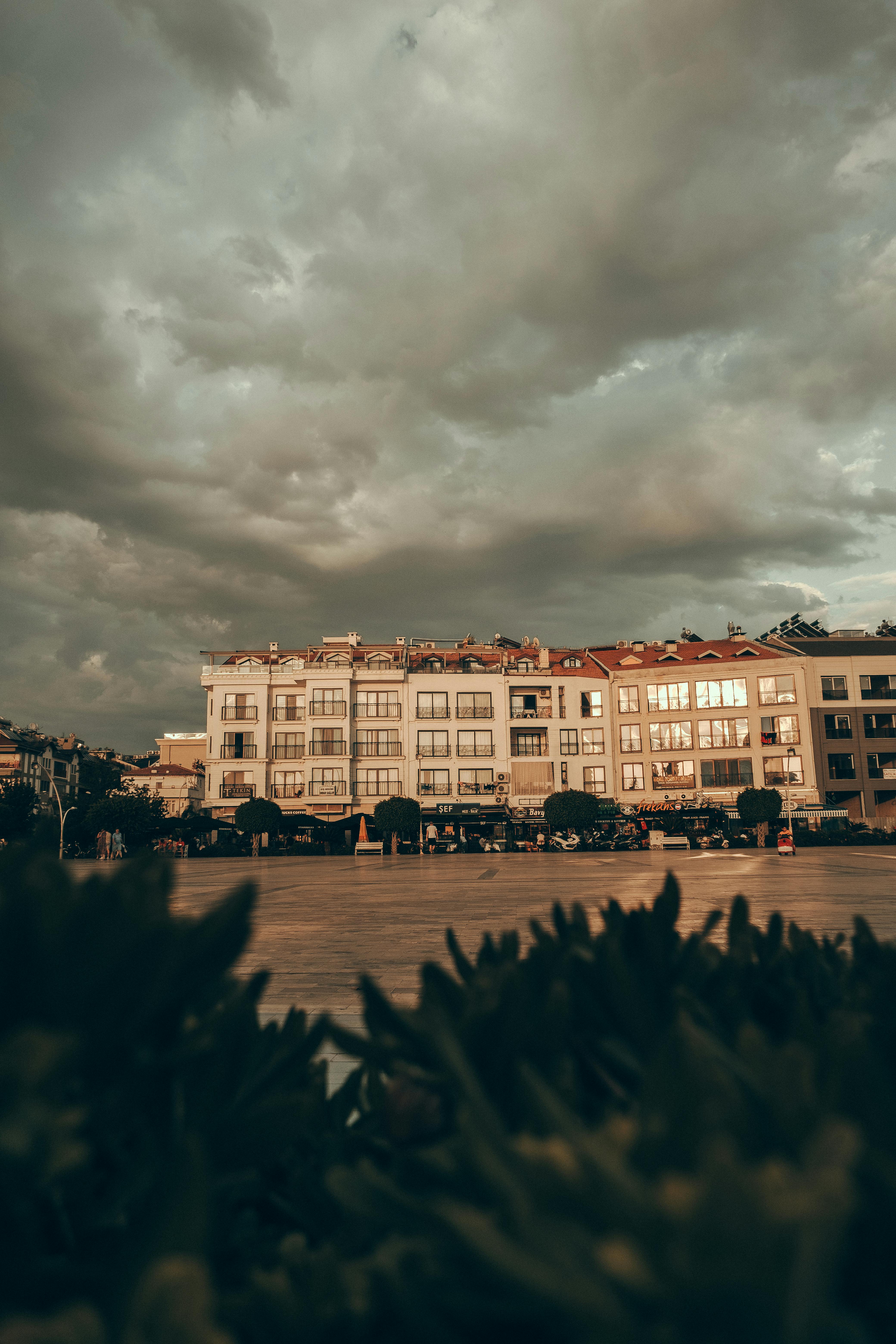 Cloudy Sky above a Buildings · Free Stock Photo