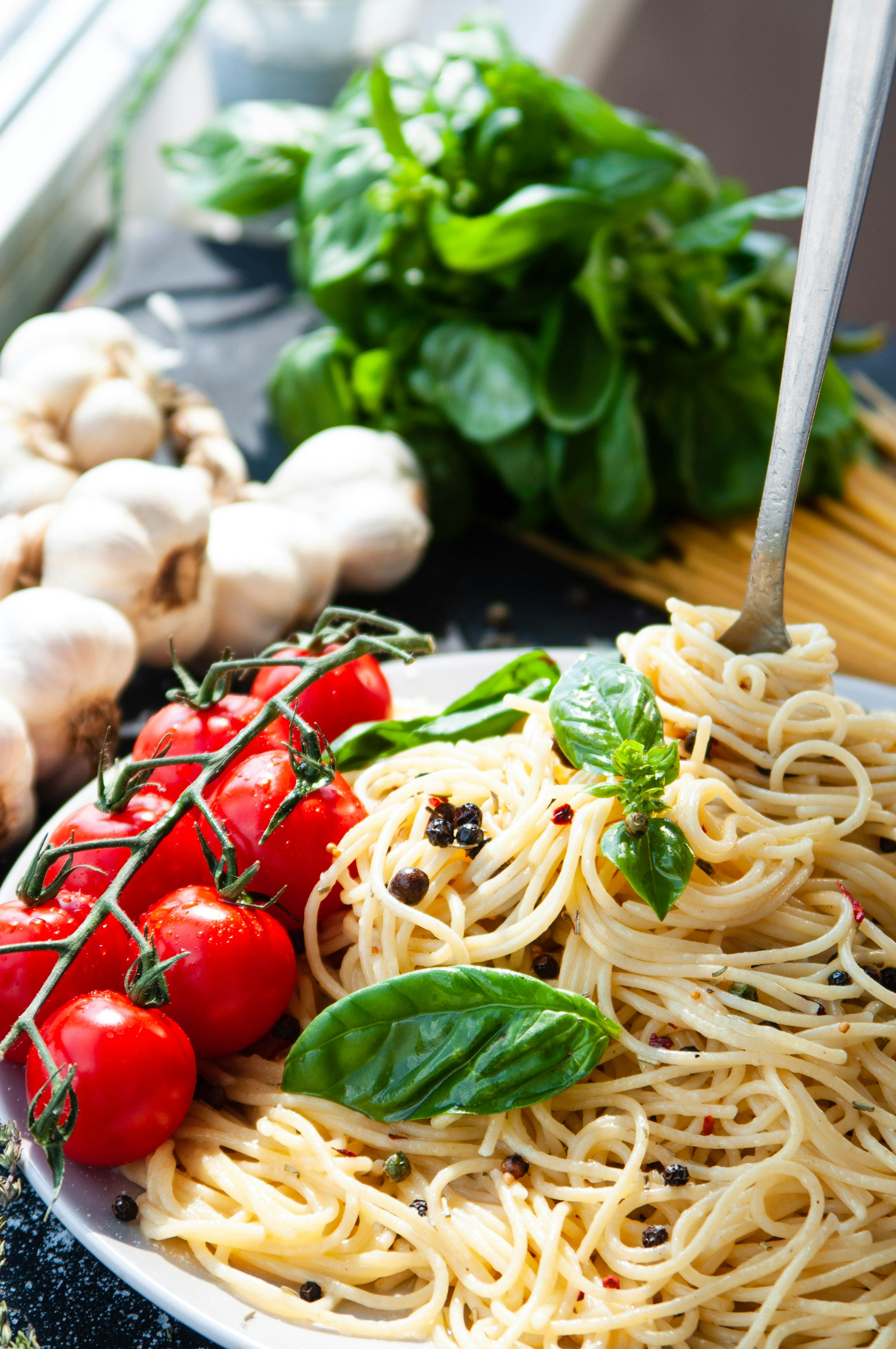 Pasta with flowers laying on plate · Free Stock Photo