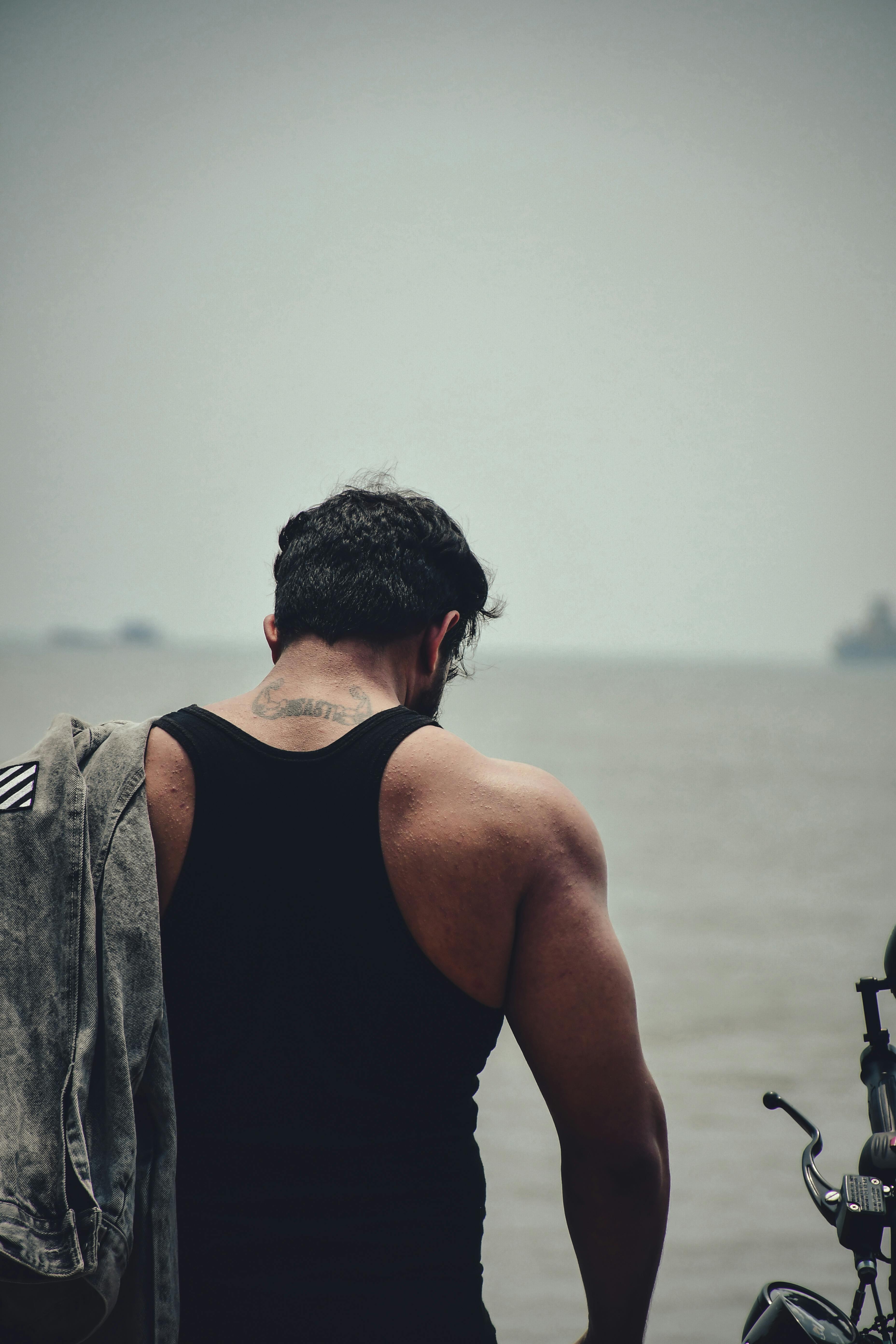 Back View of a Man in a Black Tank Top · Free Stock Photo