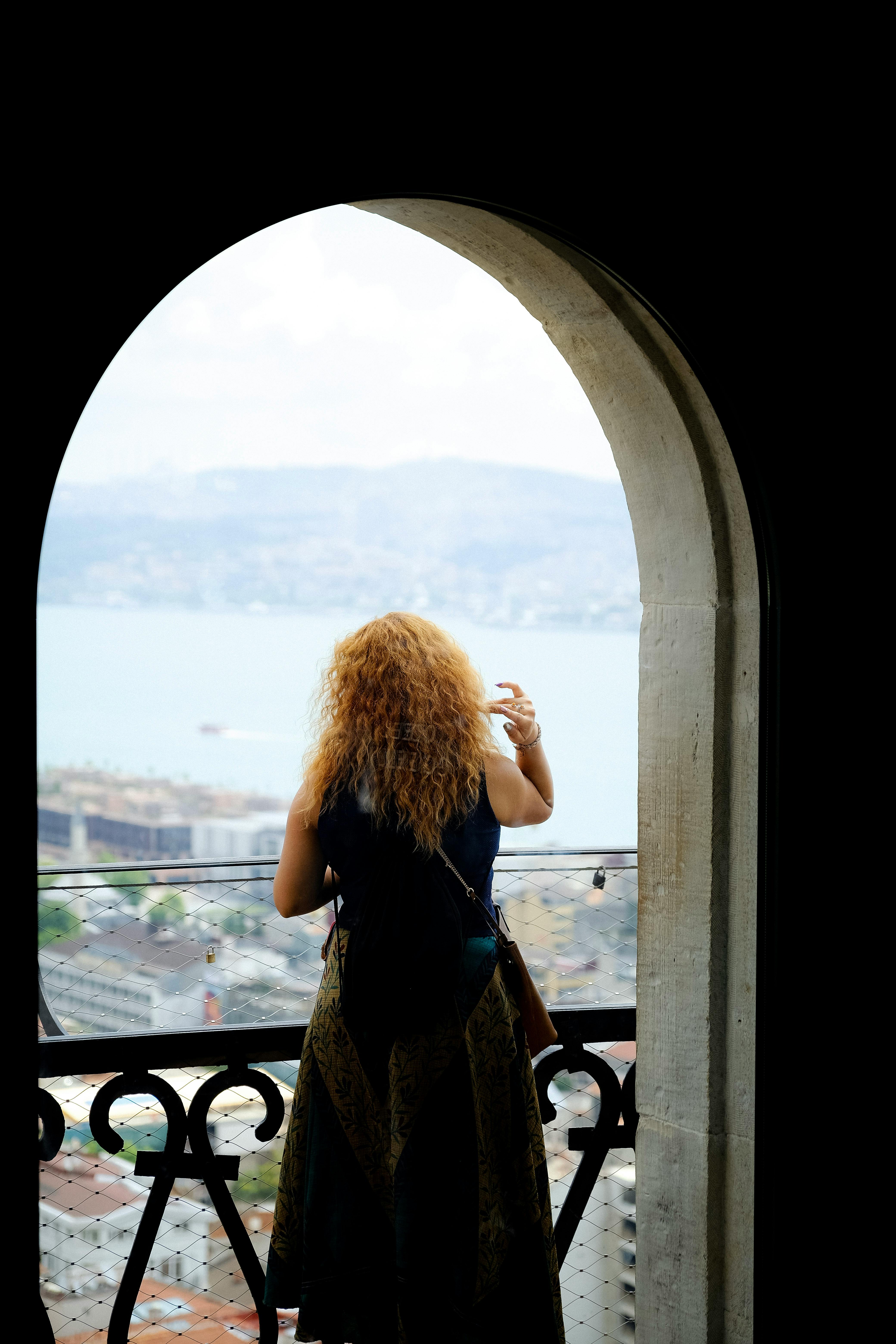 Back View of a Woman Fastening Her Zipper · Free Stock Photo