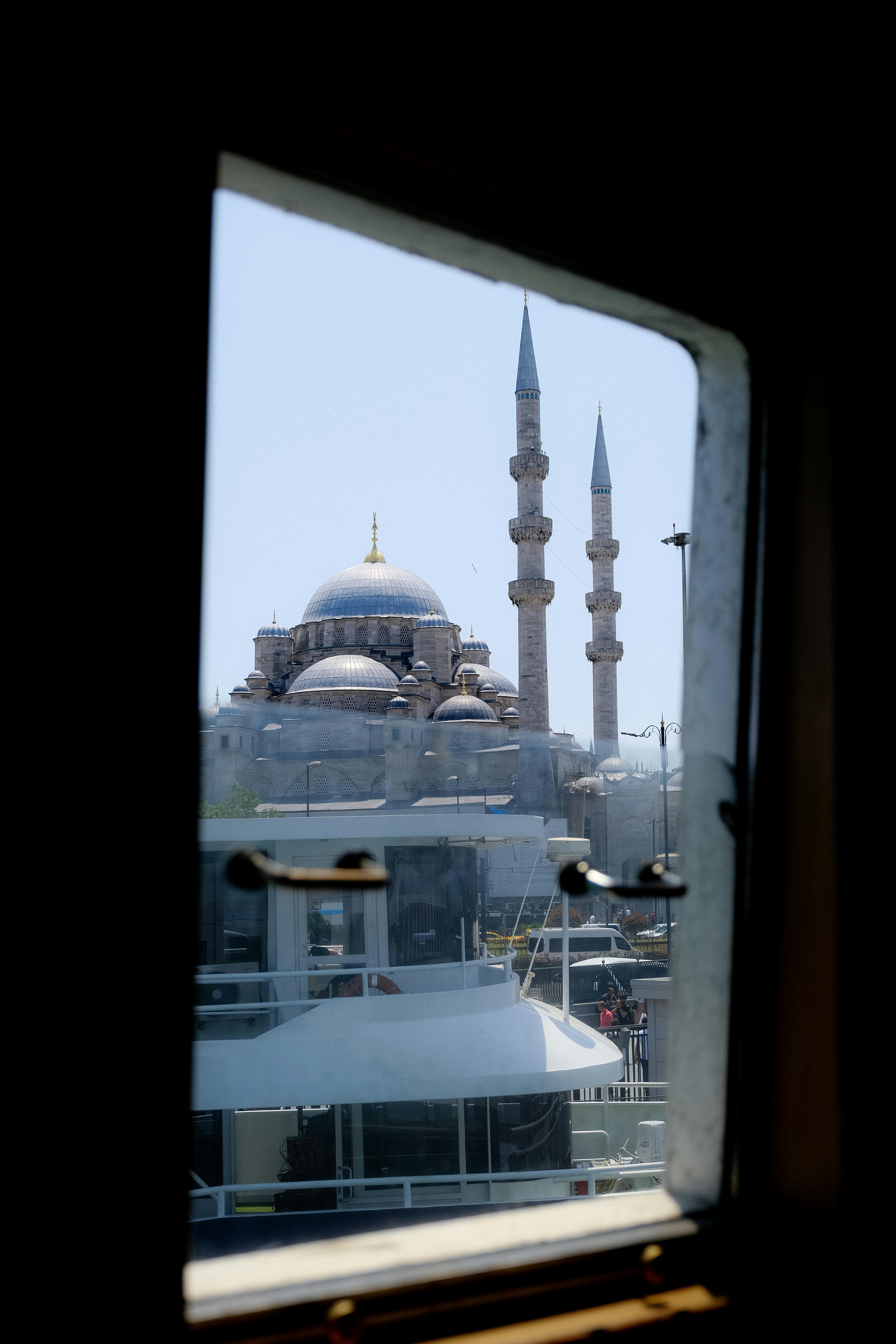 Mosque in Istanbul behind Vessel Window · Free Stock Photo