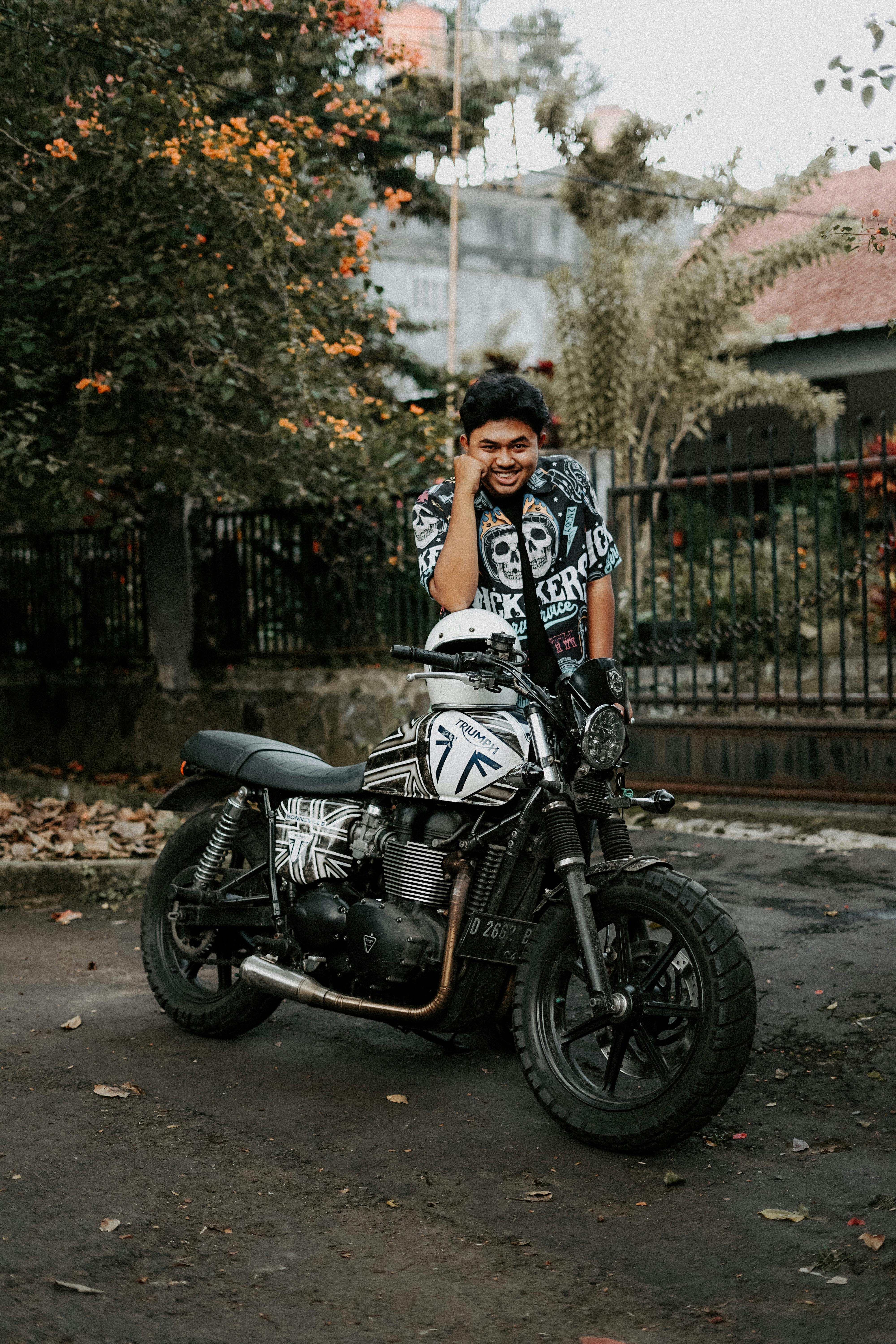 Man Posing with Motorcycle on Street · Free Stock Photo