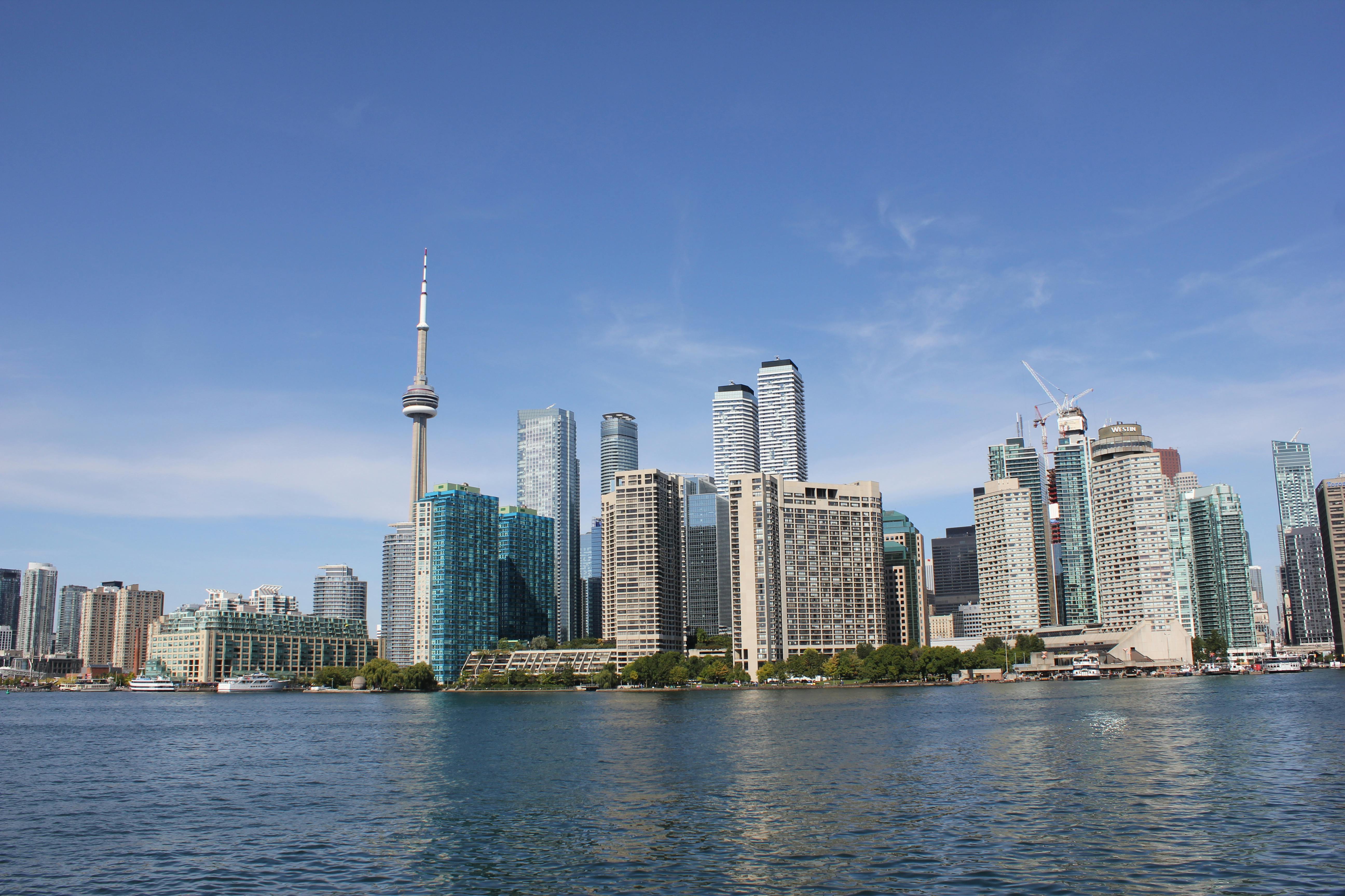 Skyscrapers in City on Sea Shore · Free Stock Photo
