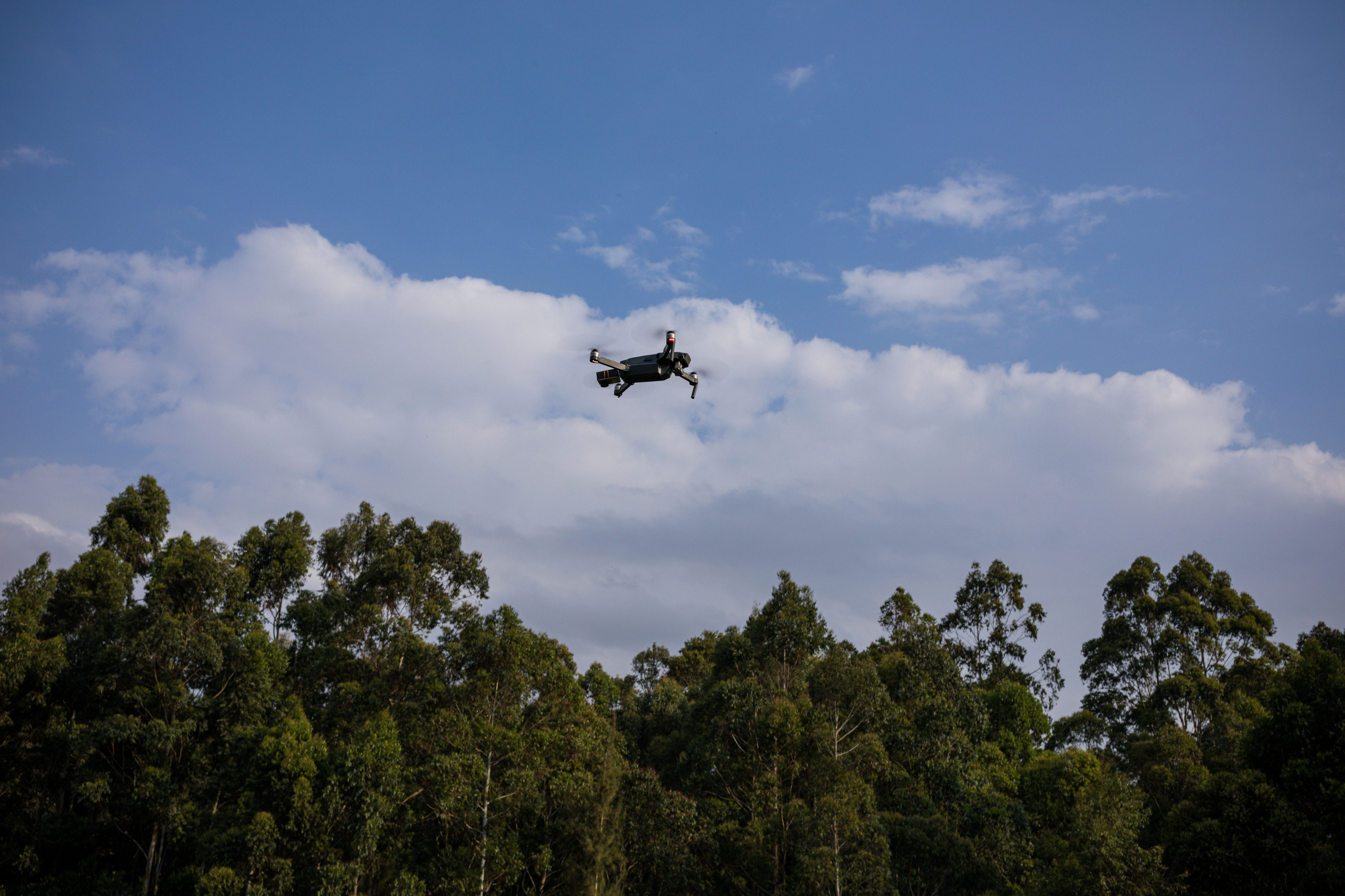 Drone Flying under Blue Sky · Free Stock Photo