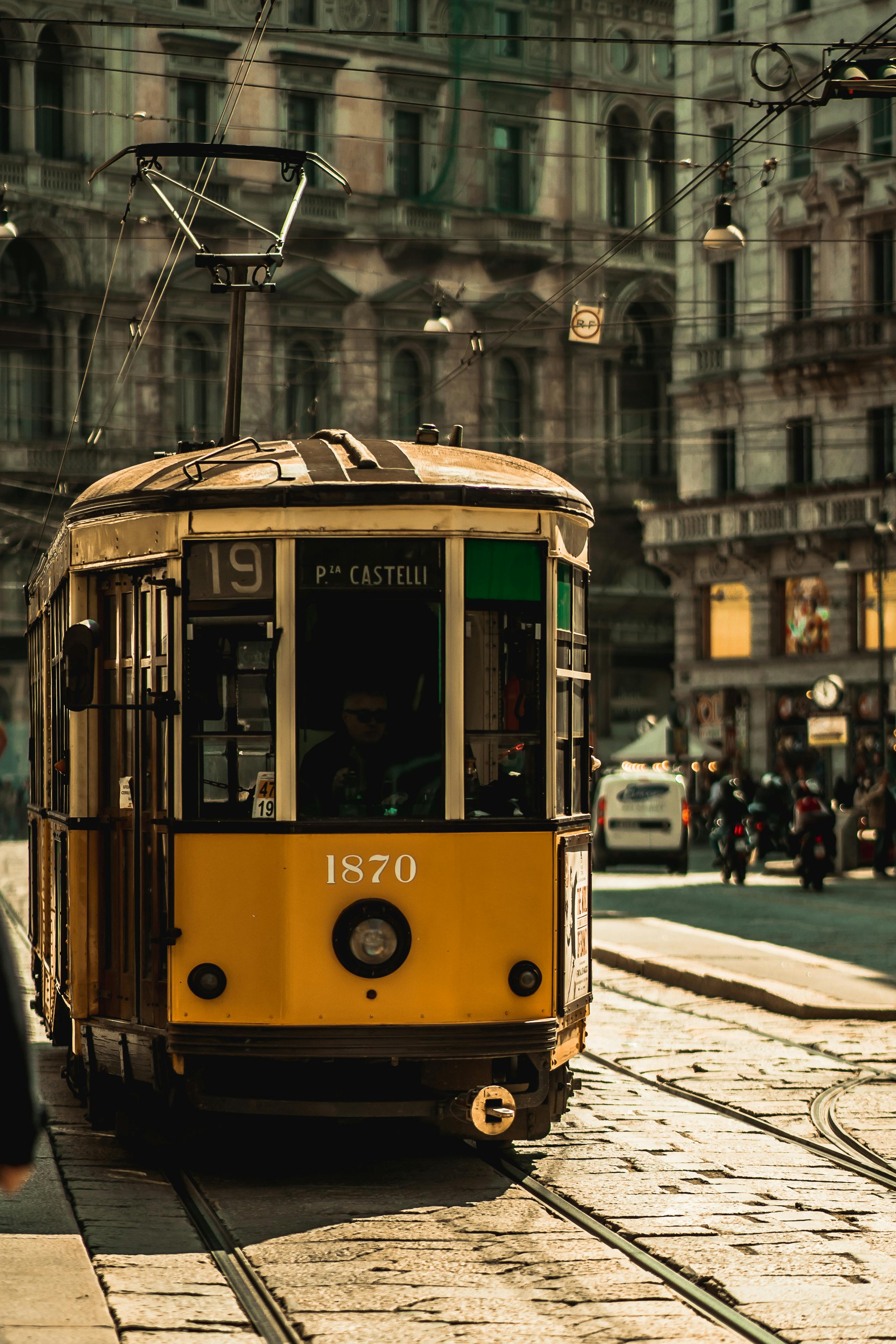 A Yellow and Brown Tram on Street · Free Stock Photo