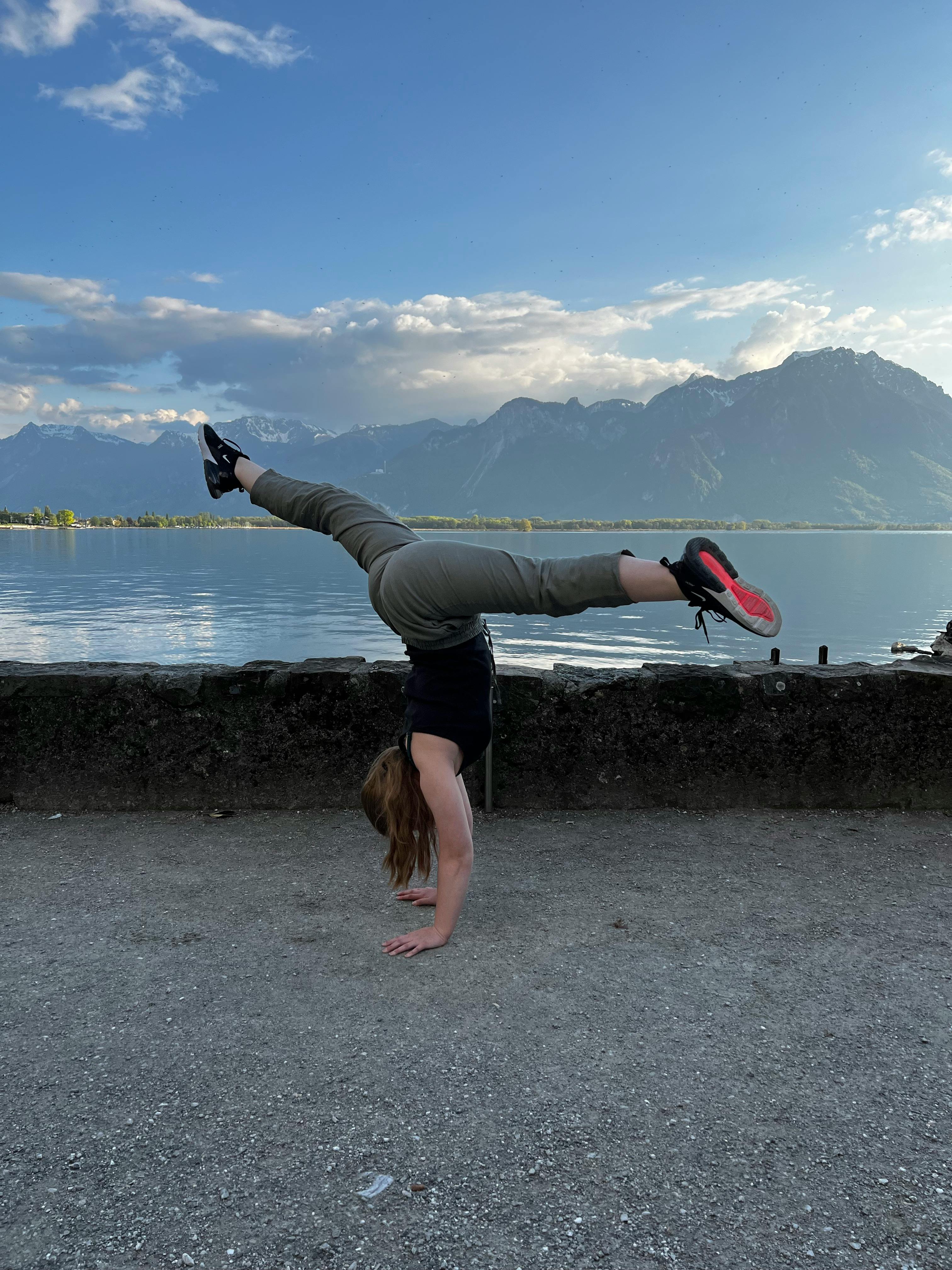 A Woman doing a Handstand near a Lake · Free Stock Photo